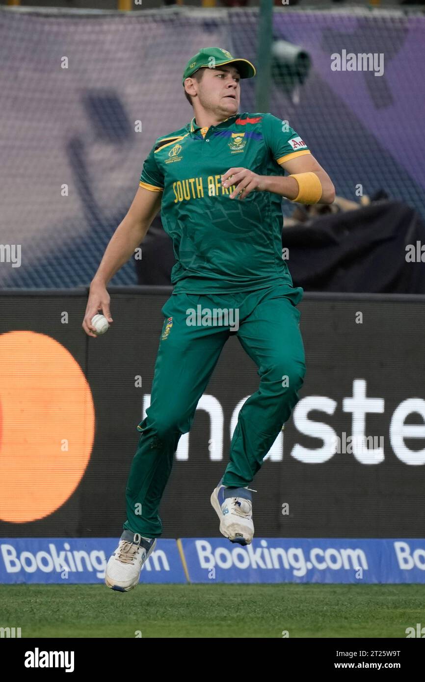 South Africa's Gerald Coetzee prepares to throw the ball as he fields ...