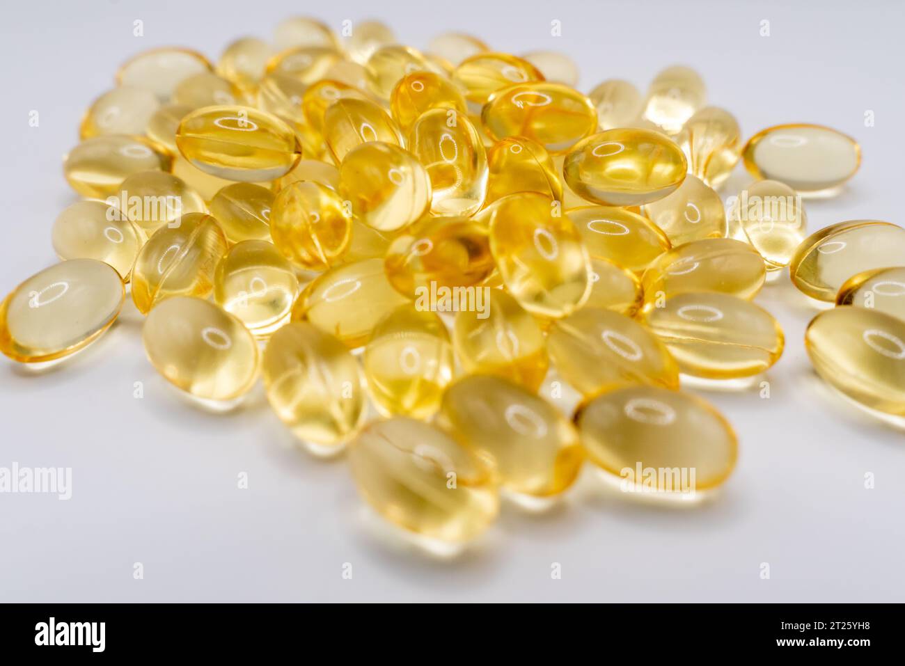 cod liver oil capsules isolated on white Stock Photo - Alamy
