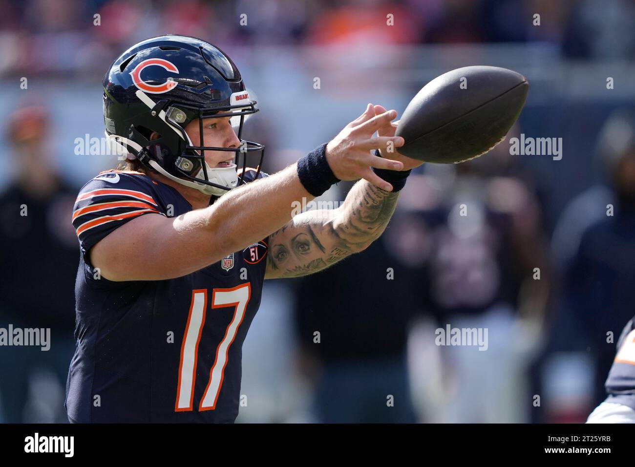Chicago Bears quarterback Tyson Bagent takes the snap from center in ...