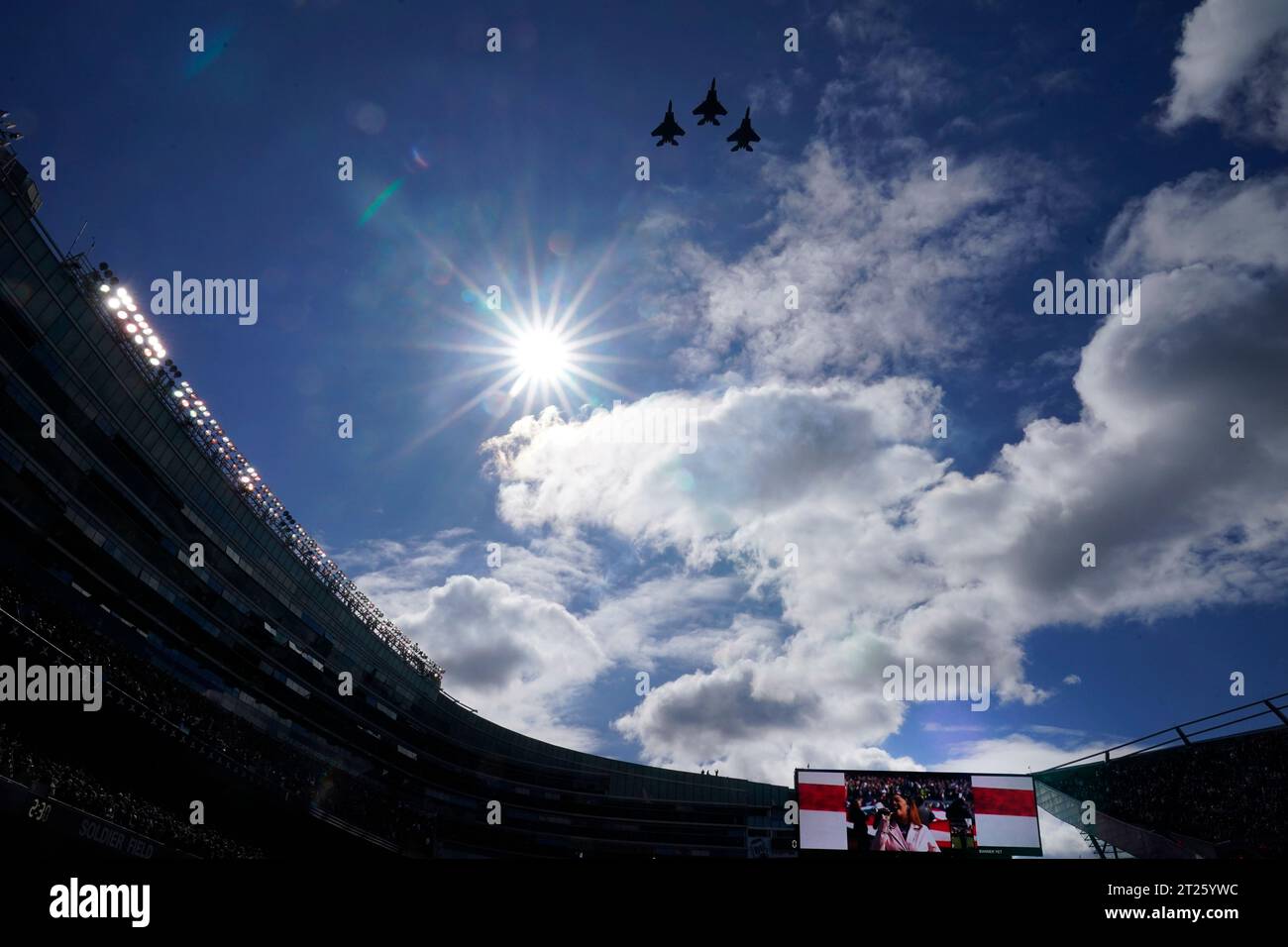 Three F-15 fighter jets perform a flyover during the national anthem ...