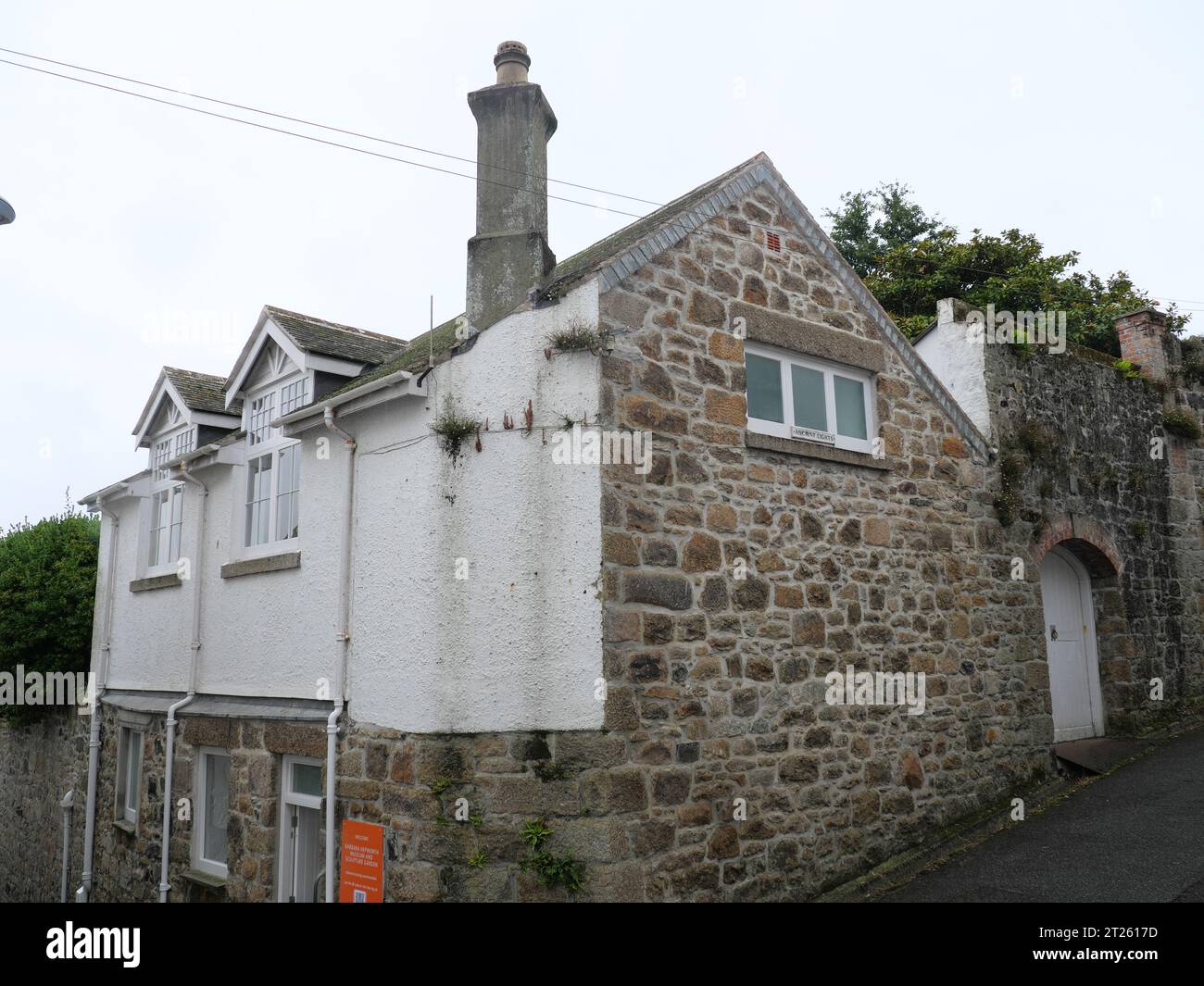 Old corner house with fieldstone wall in St Ives in Cornwall England ...