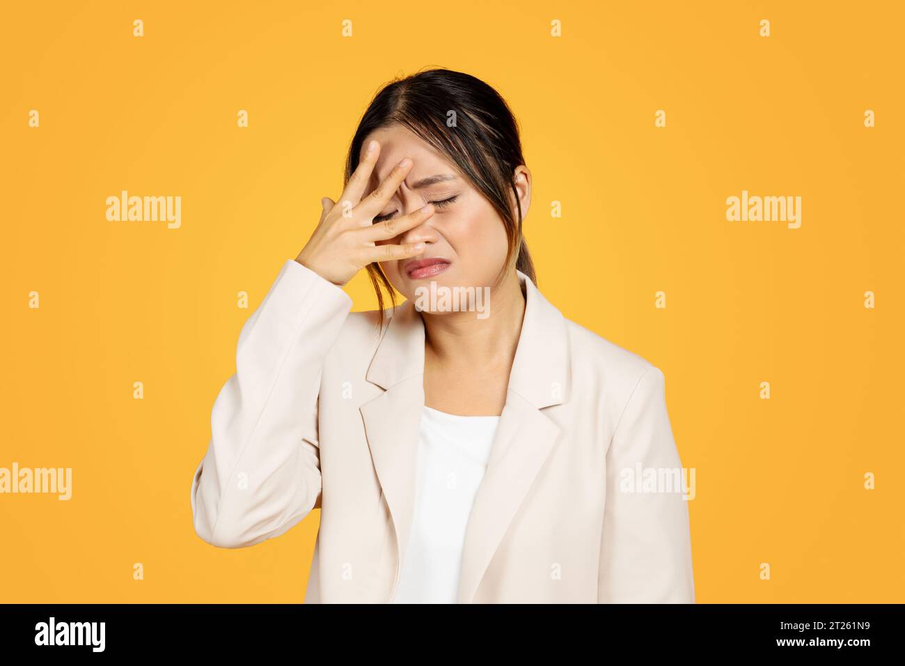 Despaired depression asian young woman in suit, with pained expression ...