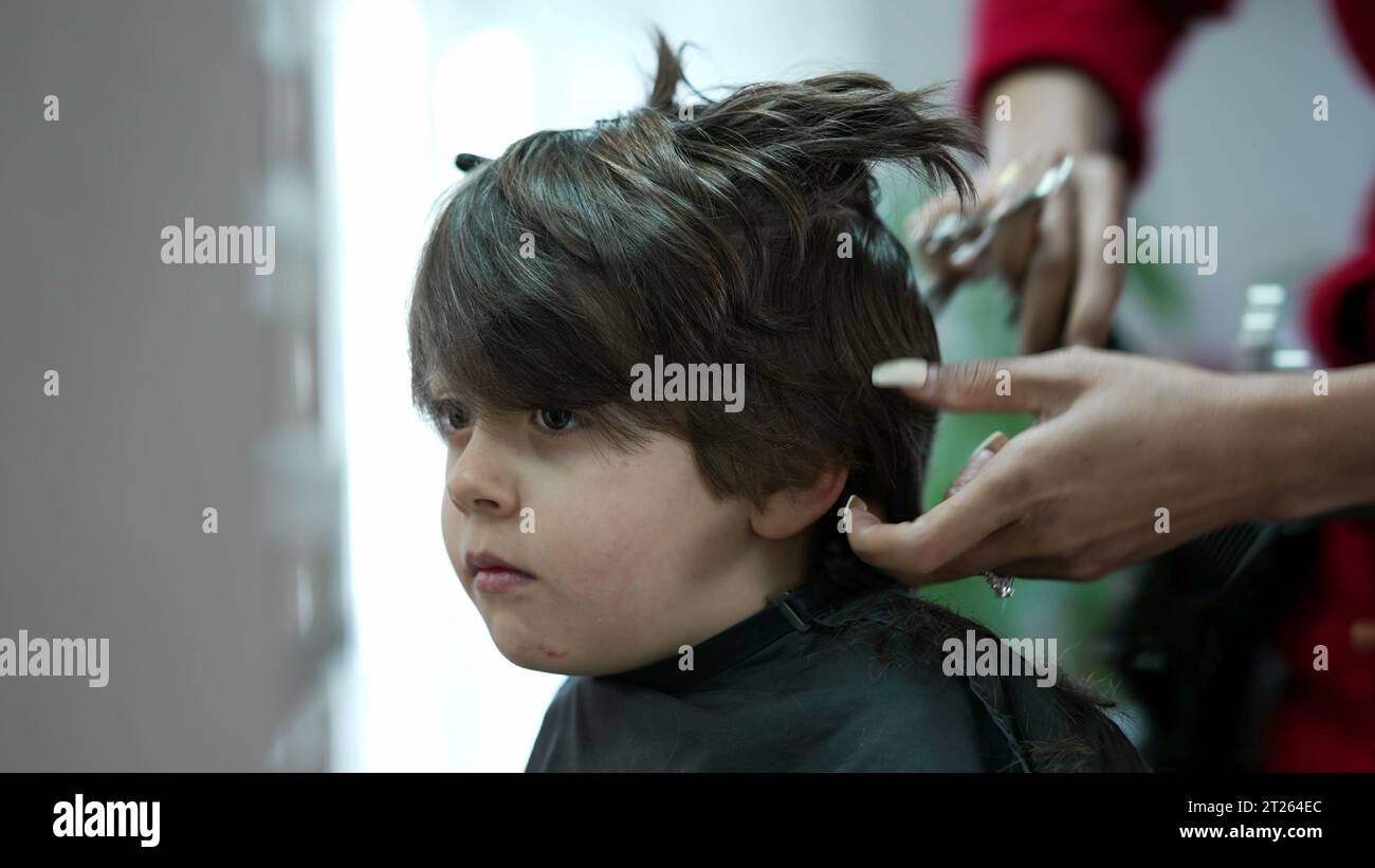 Little Boy Getting a Haircut at Hair Salon, Professional Barber Styling ...