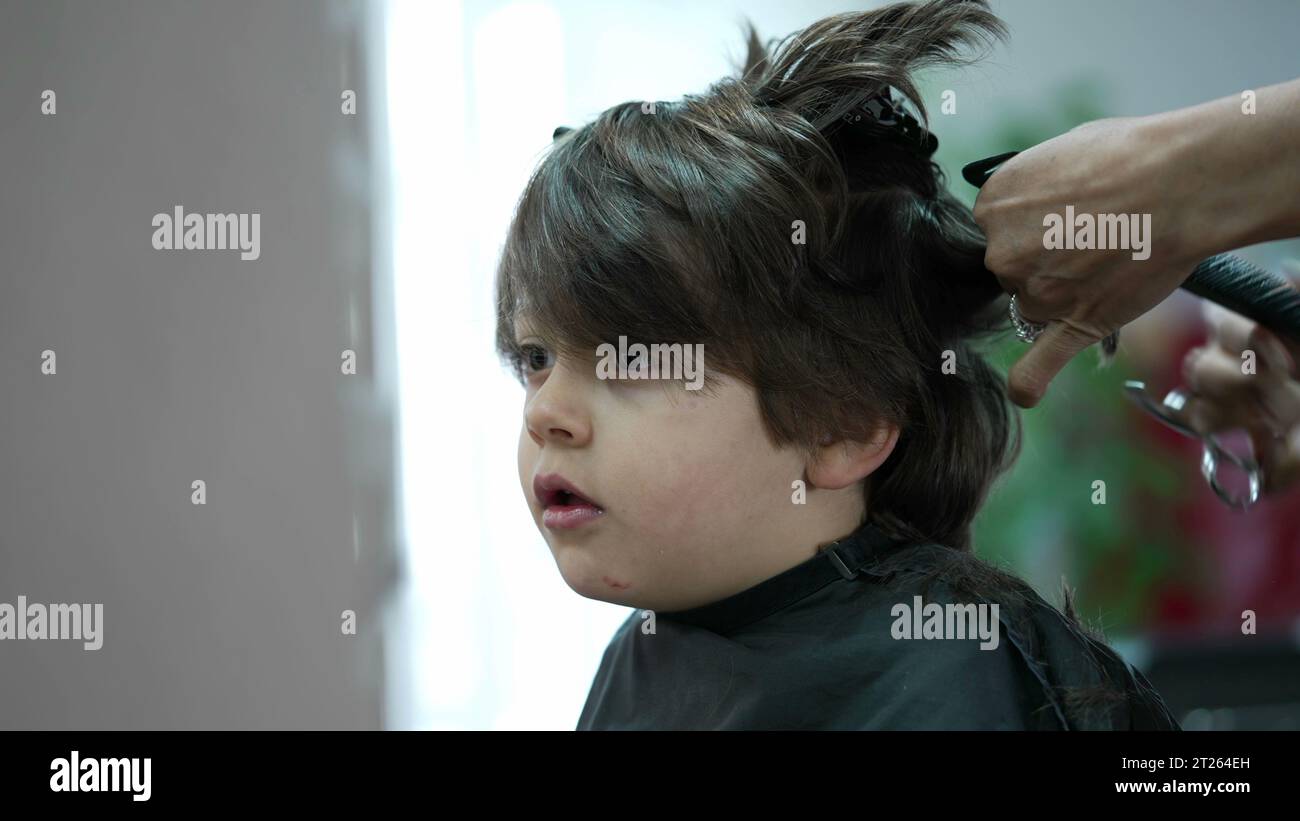 Little Boy Getting a Haircut at Hair Salon, Professional Barber Styling ...
