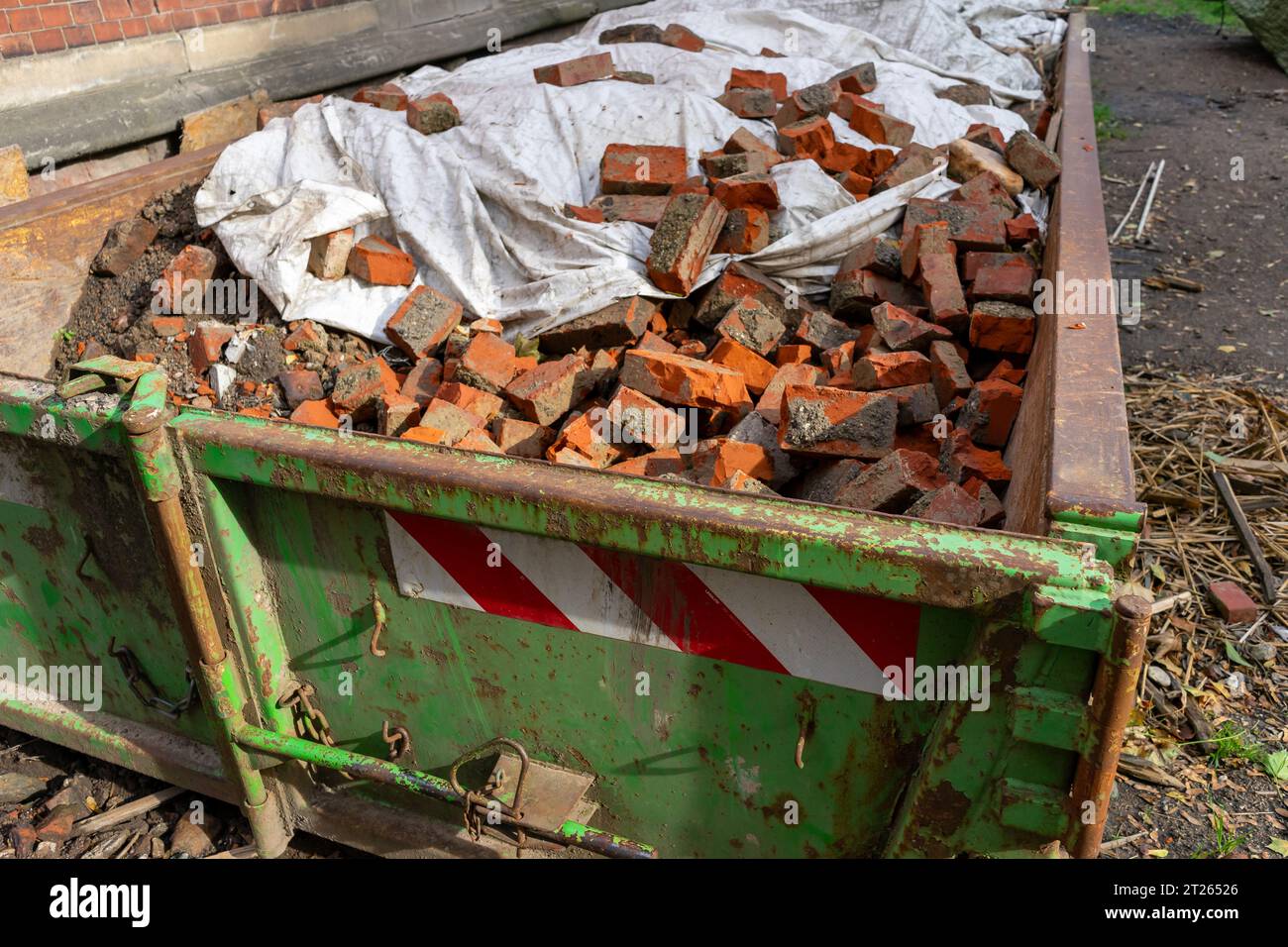 Old construction rubble in a container for recycling Stock Photo - Alamy