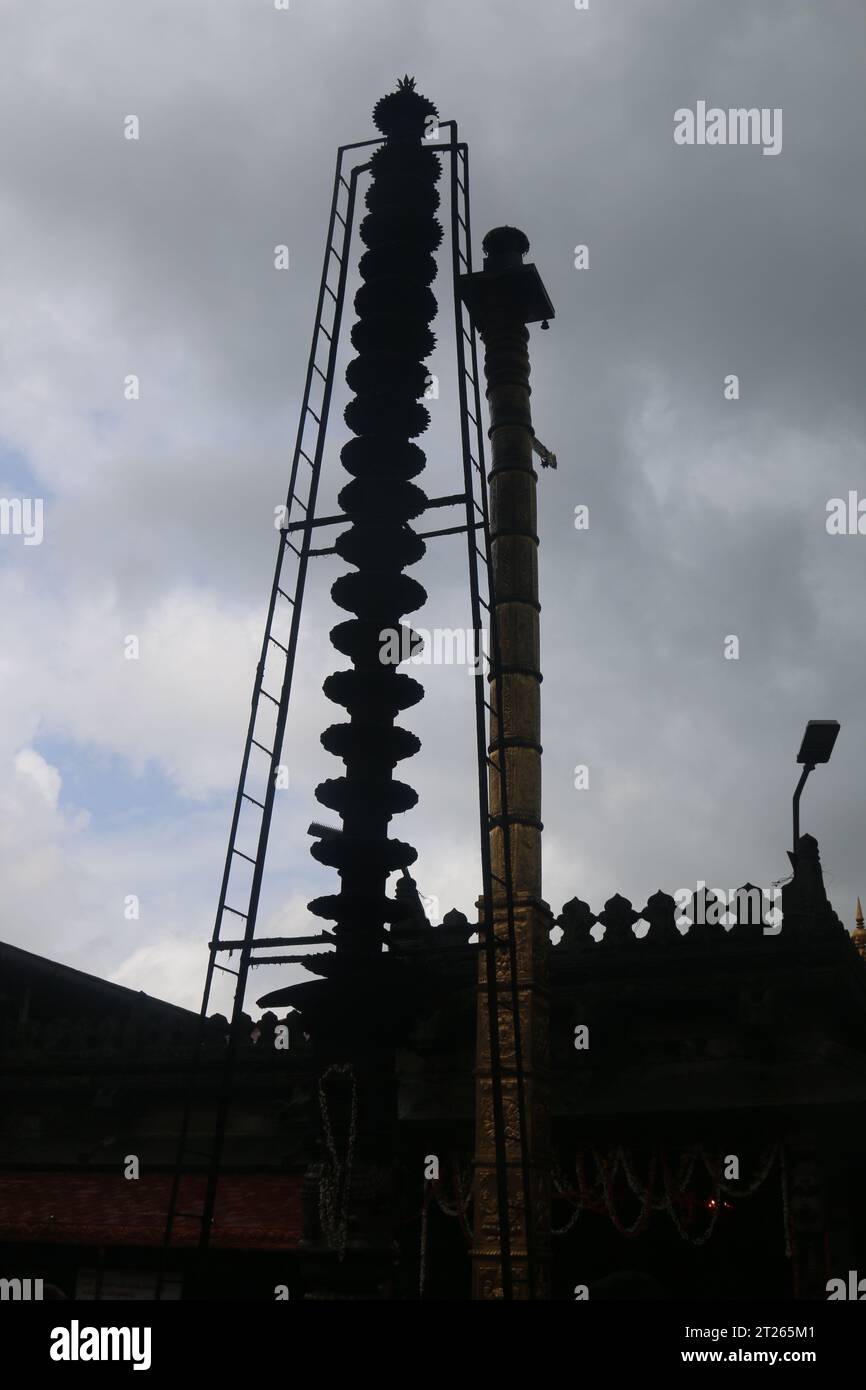 Tall Kerala traditional temple lamp Stock Photo - Alamy