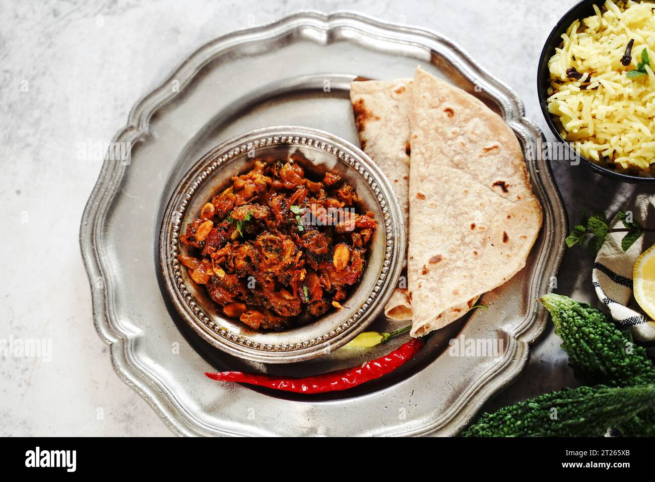 Bitter gourd curry - karela subji served with rice and roti, selective ...