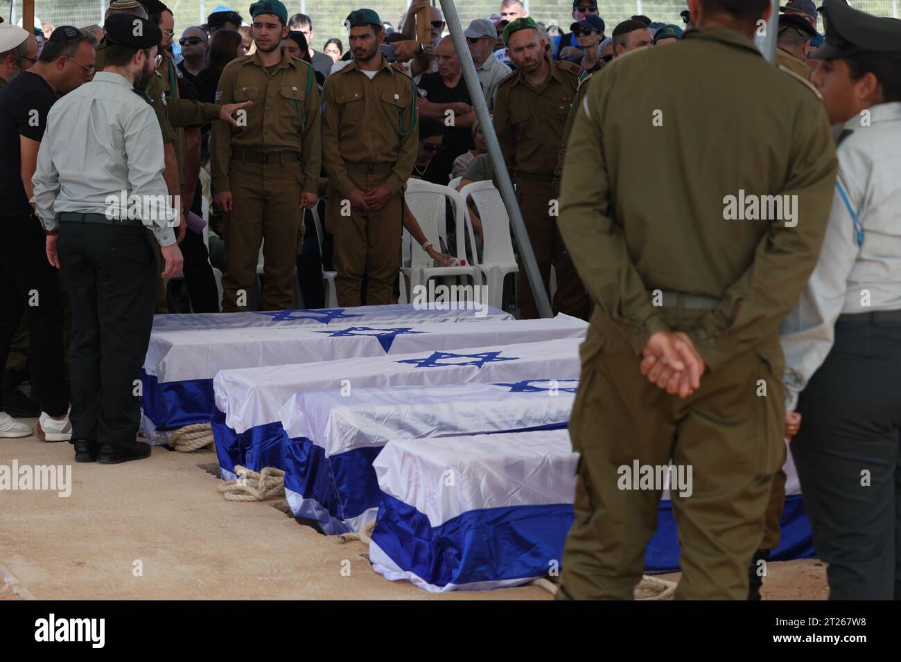 Gan Yavne, Israel. 17th Oct, 2023. Soldiers and relatives stand by the ...