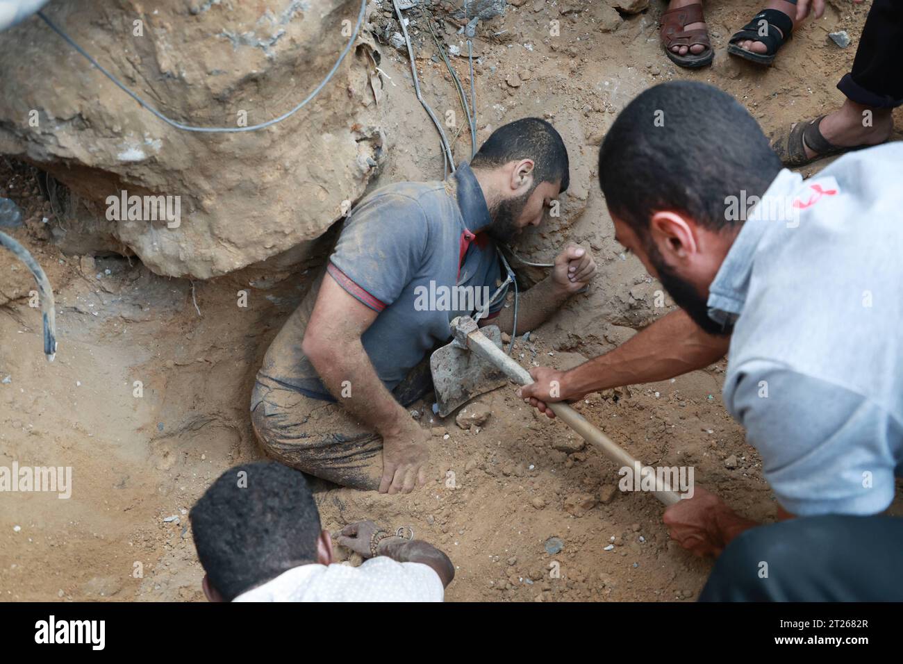 Palestinians evacuate victims following an Israeli airstrike on ...