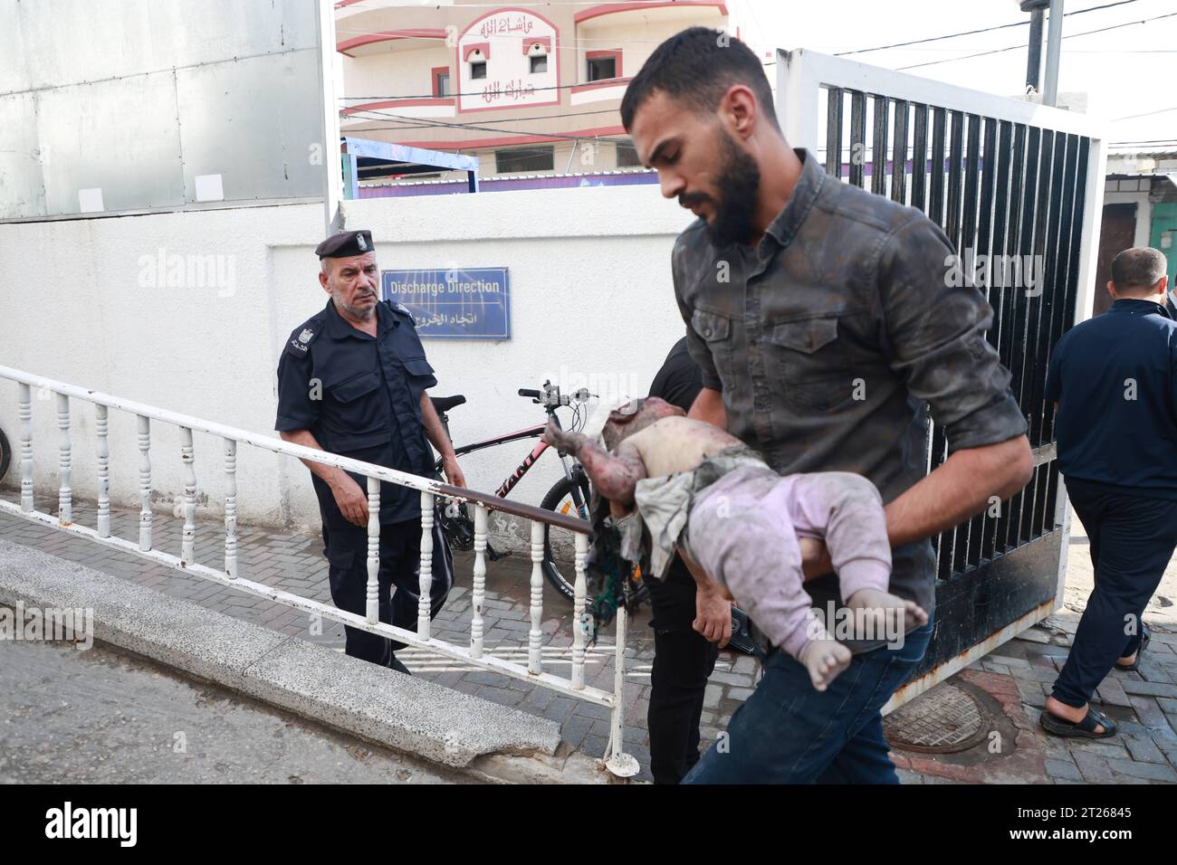 Palestinians evacuate victims following an Israeli airstrike on ...