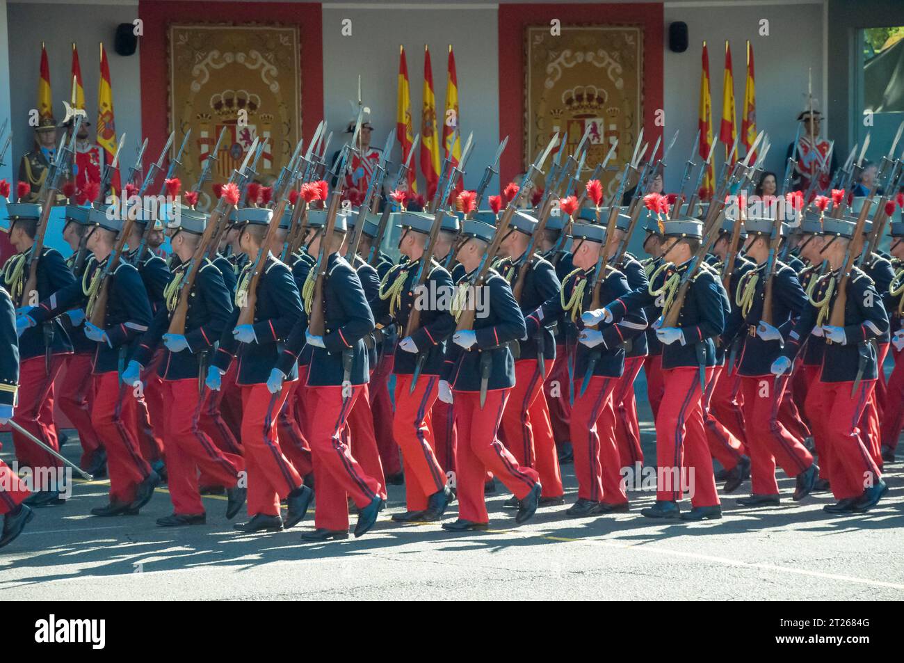 Marching soldiers wearing black tunic and red trousers, some 4,100 military personnel ...