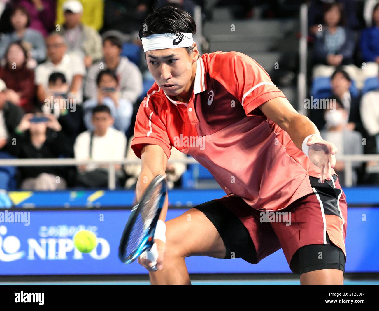 Tokyo, Japan. 17th Oct, 2023. Yosuke Watanuki of Japan returns the ball against Casper Ruud of ...