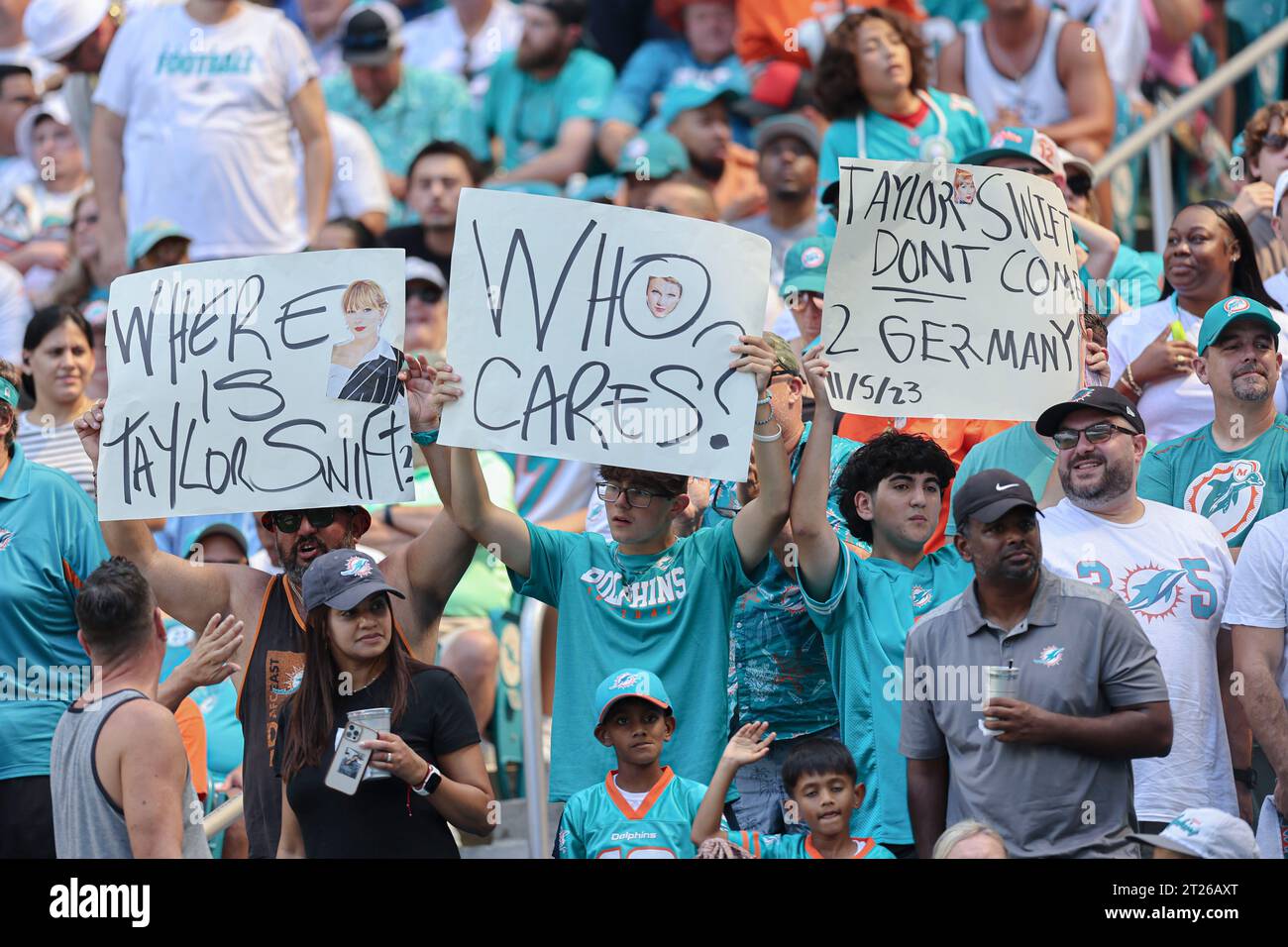 Miami. FL USA; Miami Dolphins fans waves signs about the upcoming game ...