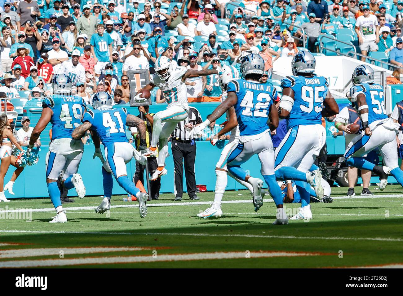 Miami. FL USA; Miami Dolphins running back Raheem Mostert (31) runs and leaps towards the end ...