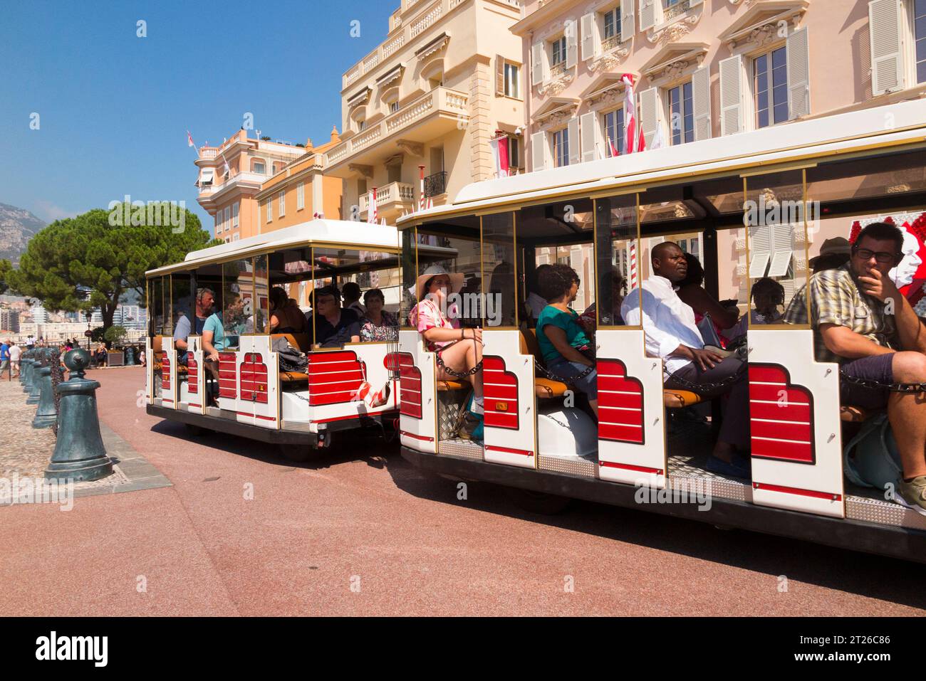 Tourist sightseeing train / trains with visitors enjoying tour of Place ...