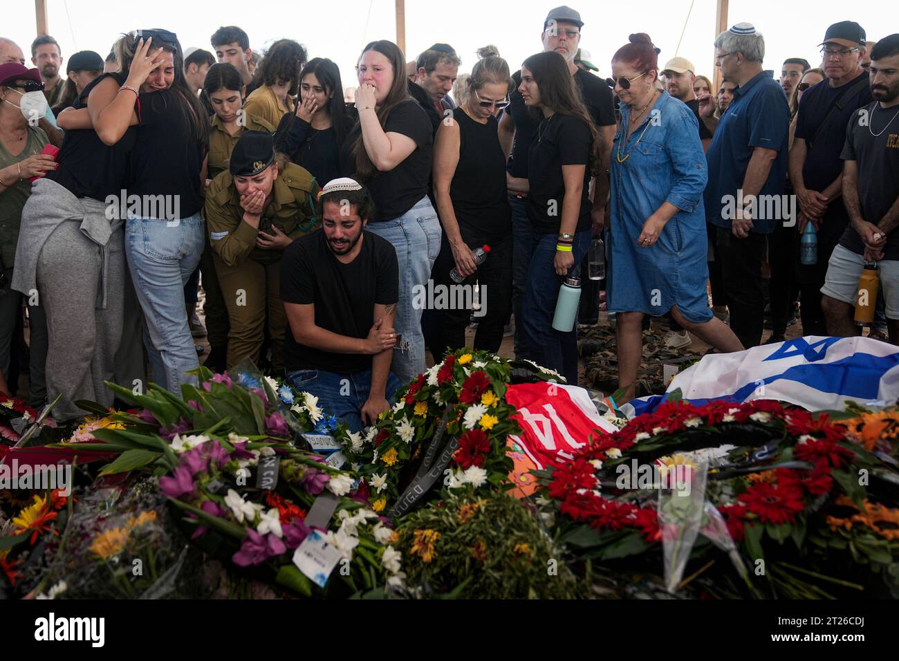 Mourners attend the funeral of the Kotz family in Gan Yavne, Israel ...