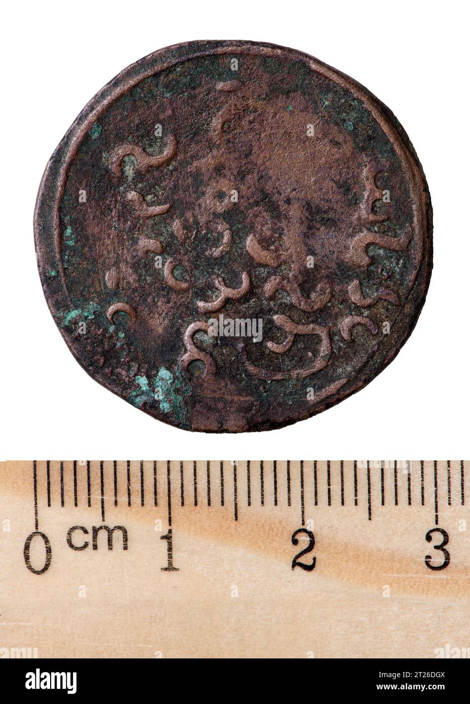 An ancient rusty copper Burmese coin depicting two fishes. Reverse ...