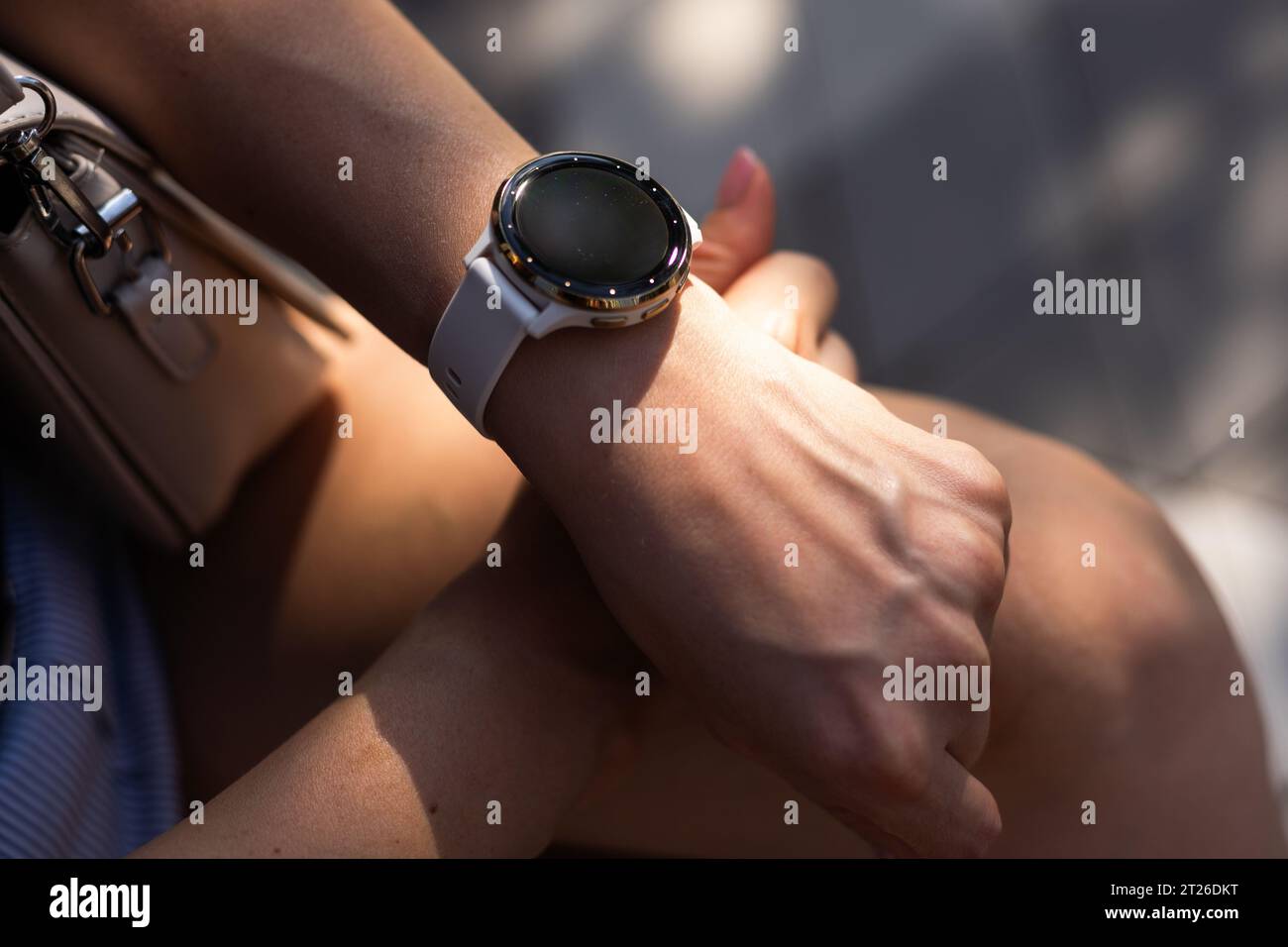 Woman hand wearing a smartwatch and checking active lifestyle and using ...
