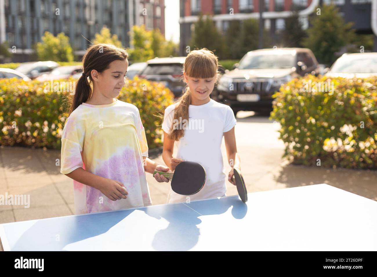 Cute girls playing ping-pong indoors Stock Photo - Alamy