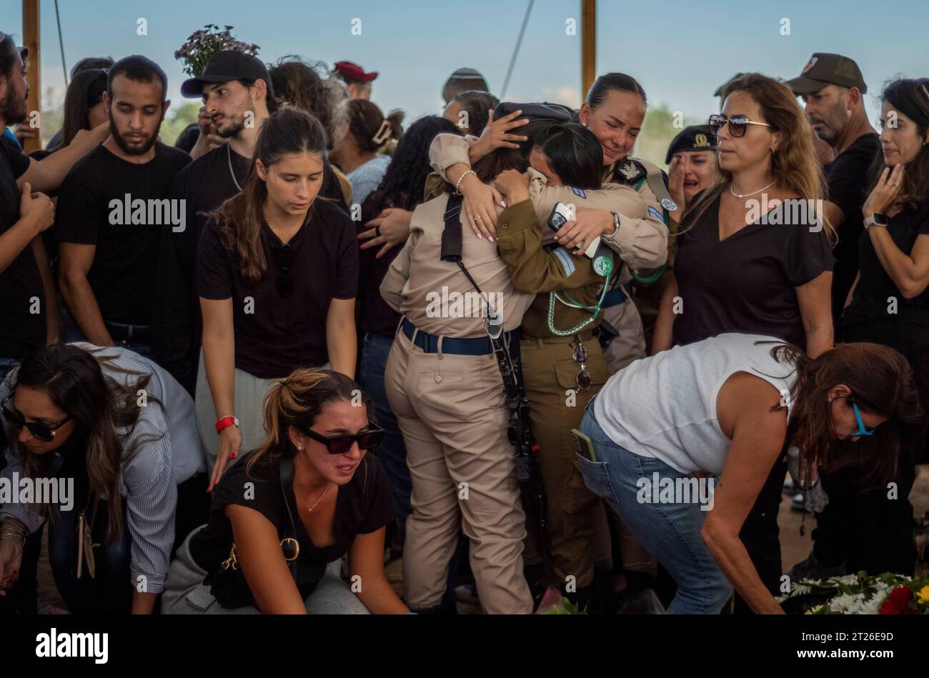 Gan Yavne, Israel. 17th Oct, 2023. People mourn as they attend the ...