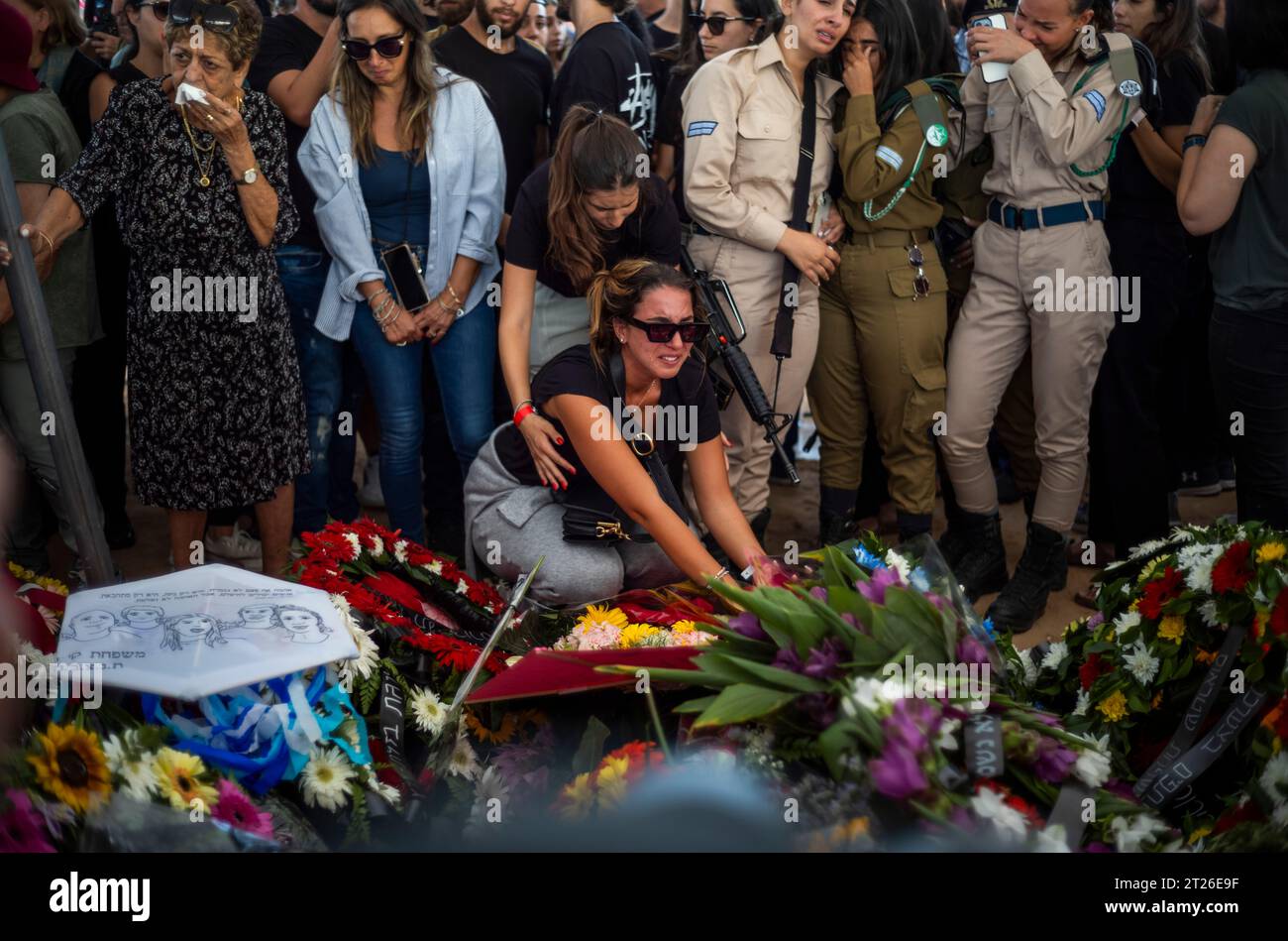 Gan Yavne, Israel. 17th Oct, 2023. People lay wreaths during the ...