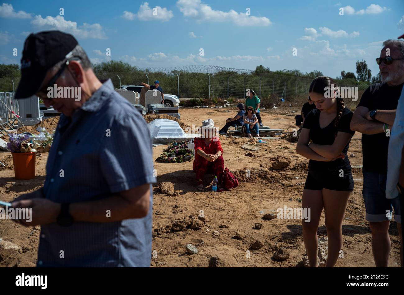 Gan Yavne, Israel. 17th Oct, 2023. People attend the burial and funeral ...