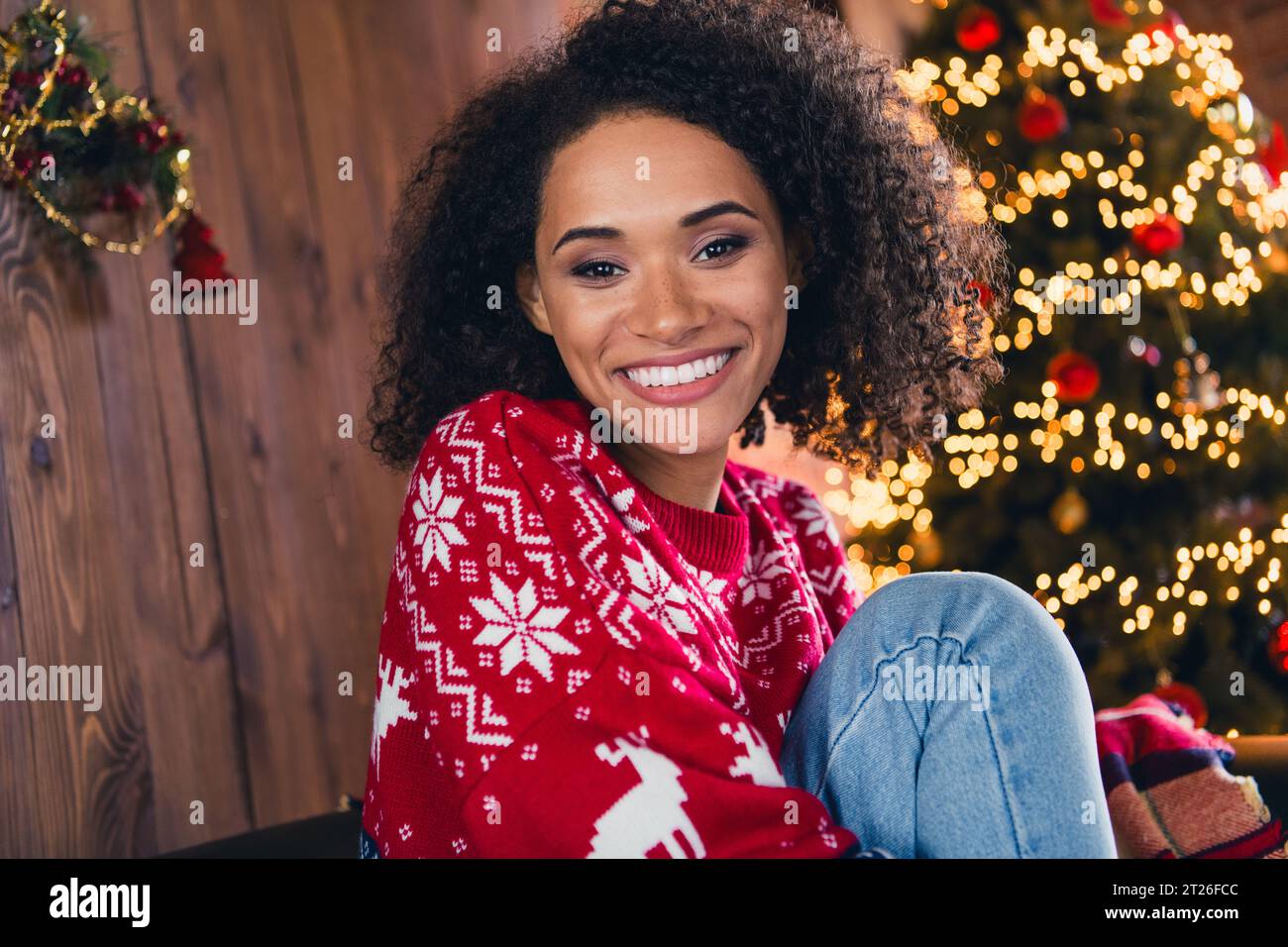 Photo of lovely cute girl sitting on comfy couch holly jolly spirit ...