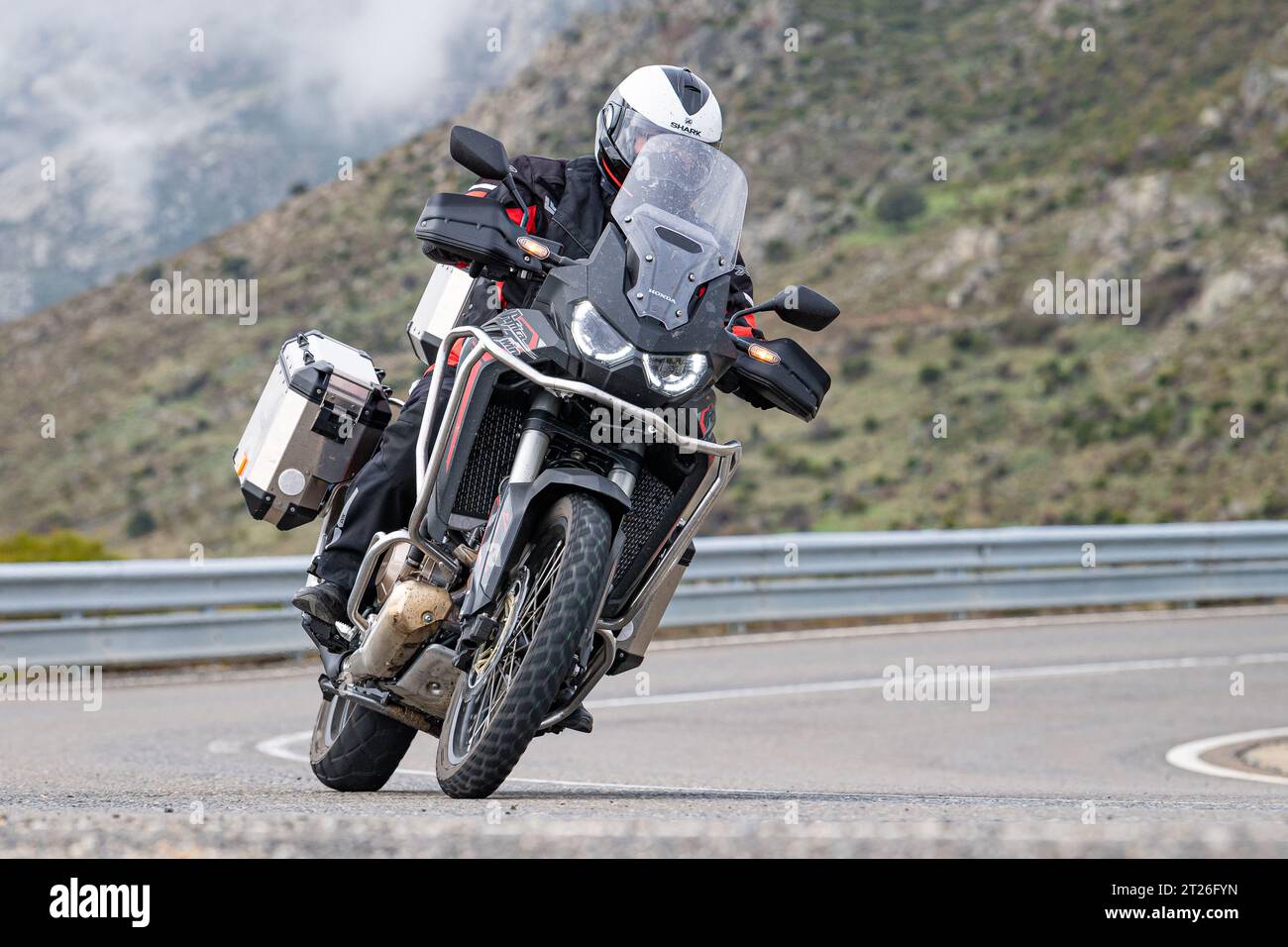 Motorcyclist taking a curve in the port of Navalmoral, province of ...