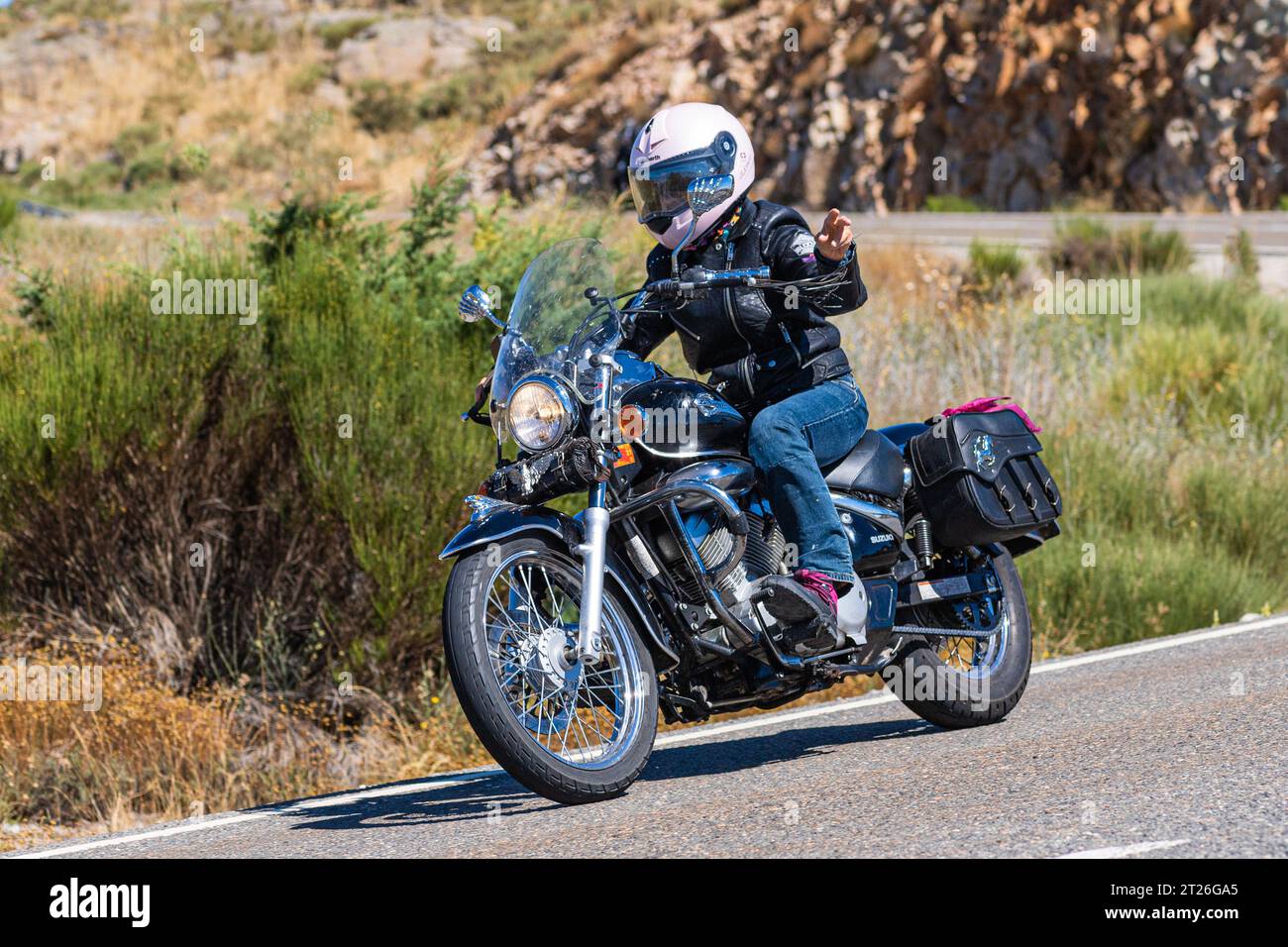 Motorcyclist taking a curve in the port of Navalmoral, province of ...