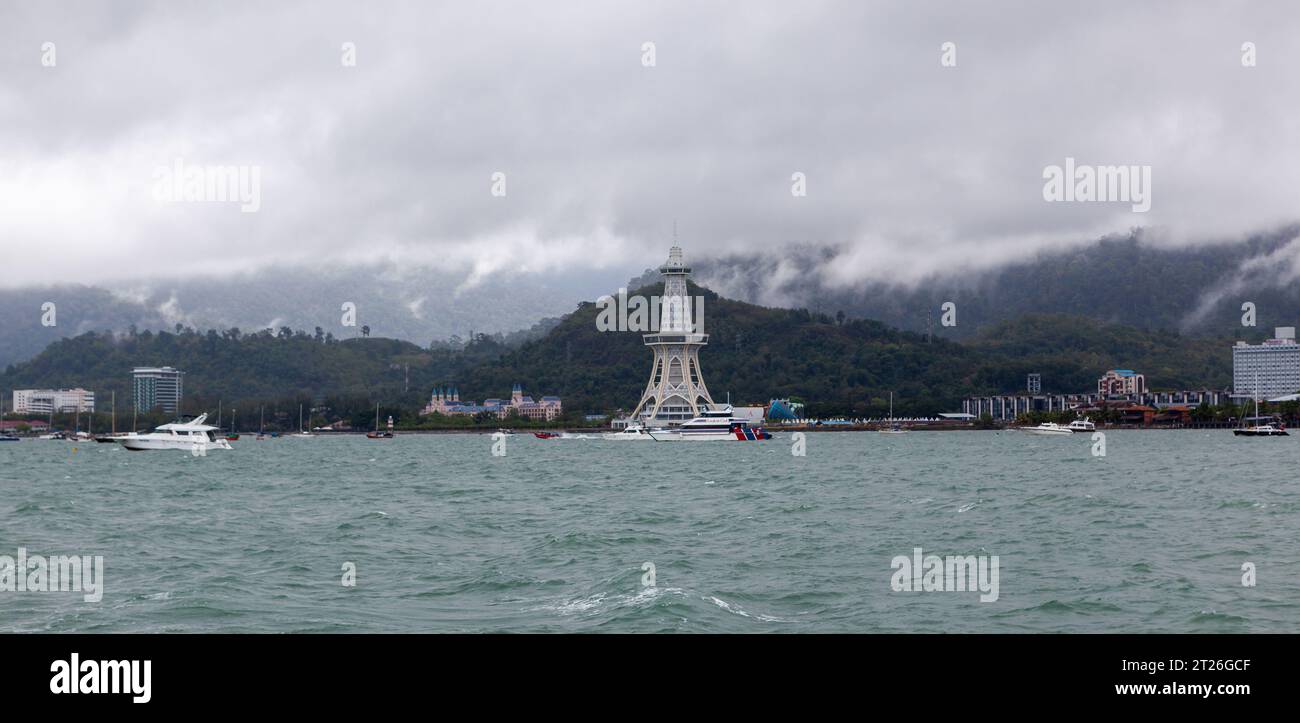 View of Maha Tower from Kuah town on a cloudy day in Langkawi, Malaysia ...