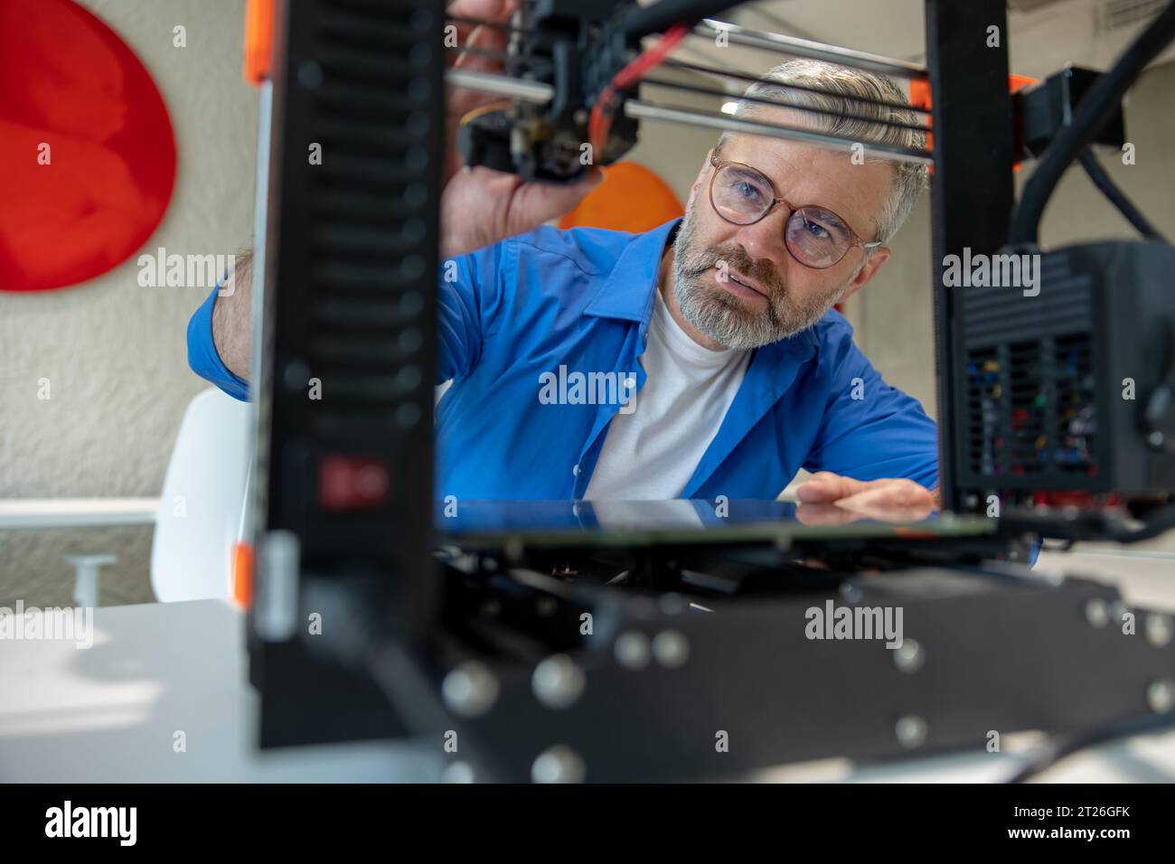 Man designer printing design using 3D printer in office Stock Photo - Alamy
