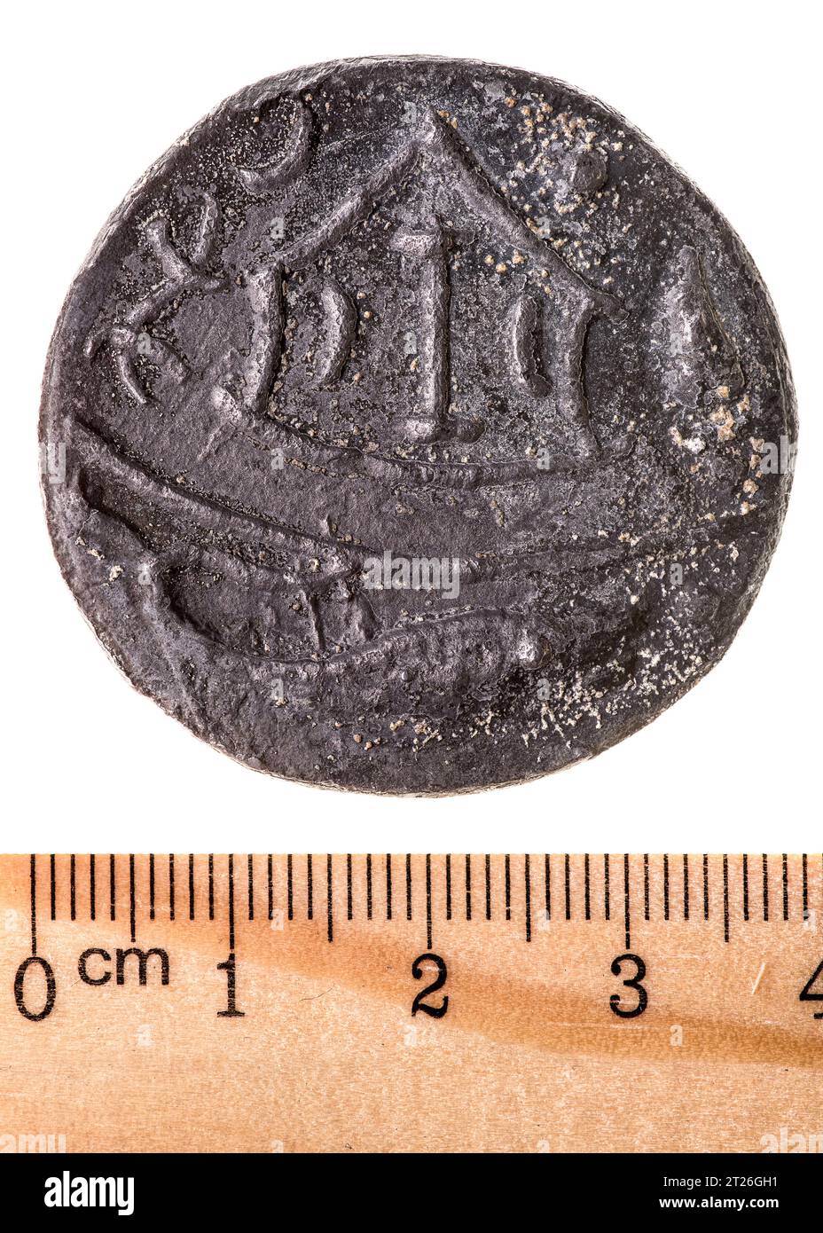 An ancient tin-zinc Siamese coin depicting a giant catfish. Reverse ...