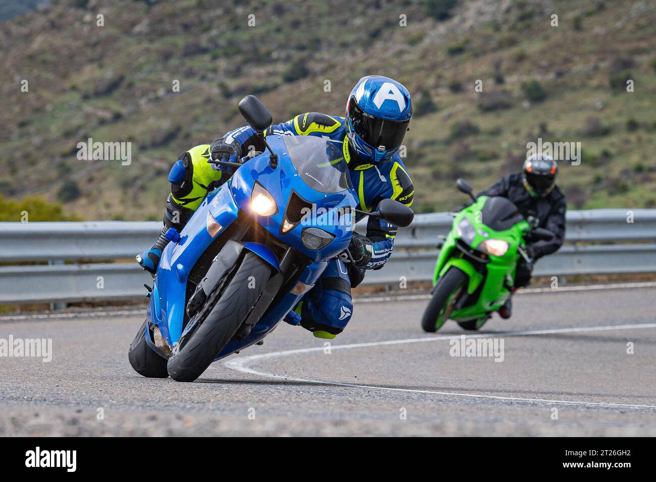 Motorcyclist taking a curve in the port of Navalmoral, province of ...