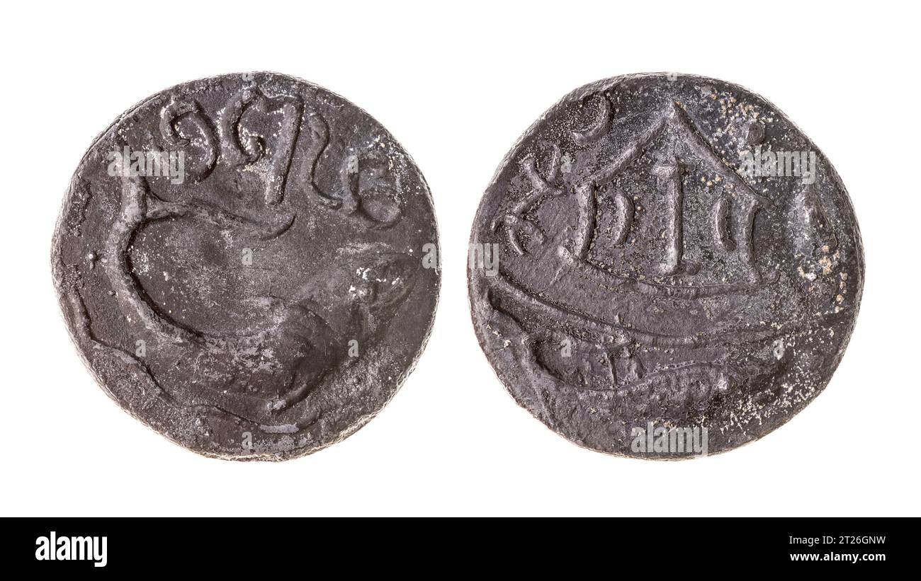 An ancient tin-zinc Siamese coin depicting a giant catfish.. Isolated ...