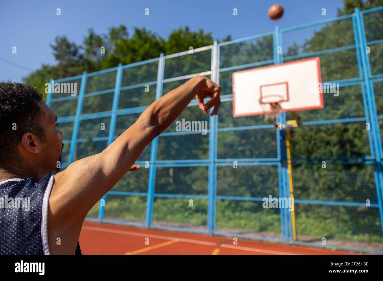Man in wheelchair, person with disability throwing the ball into the ...