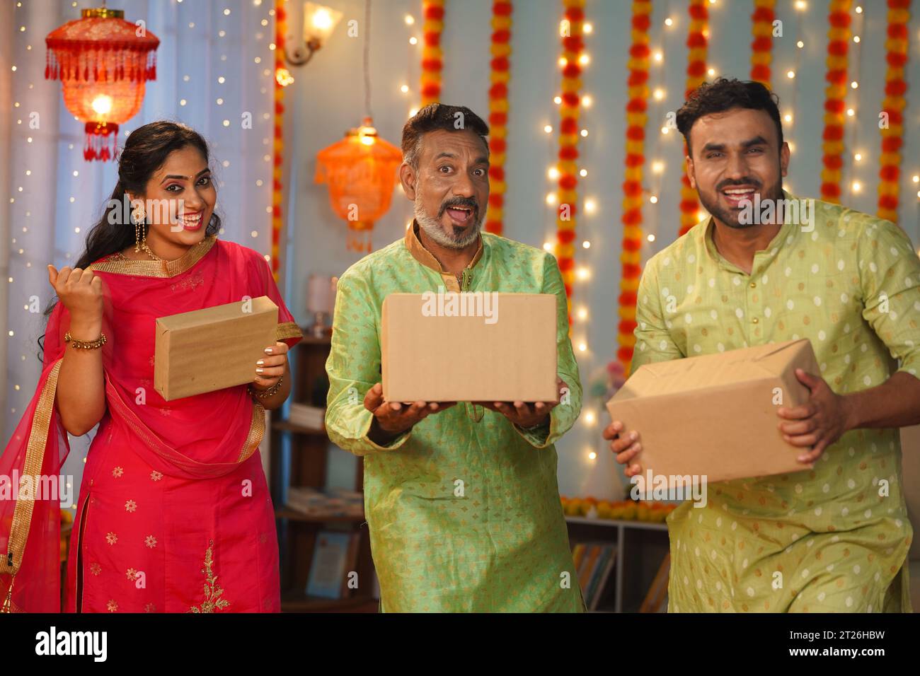 happy Indian couples with senior father dancing together by holding ...