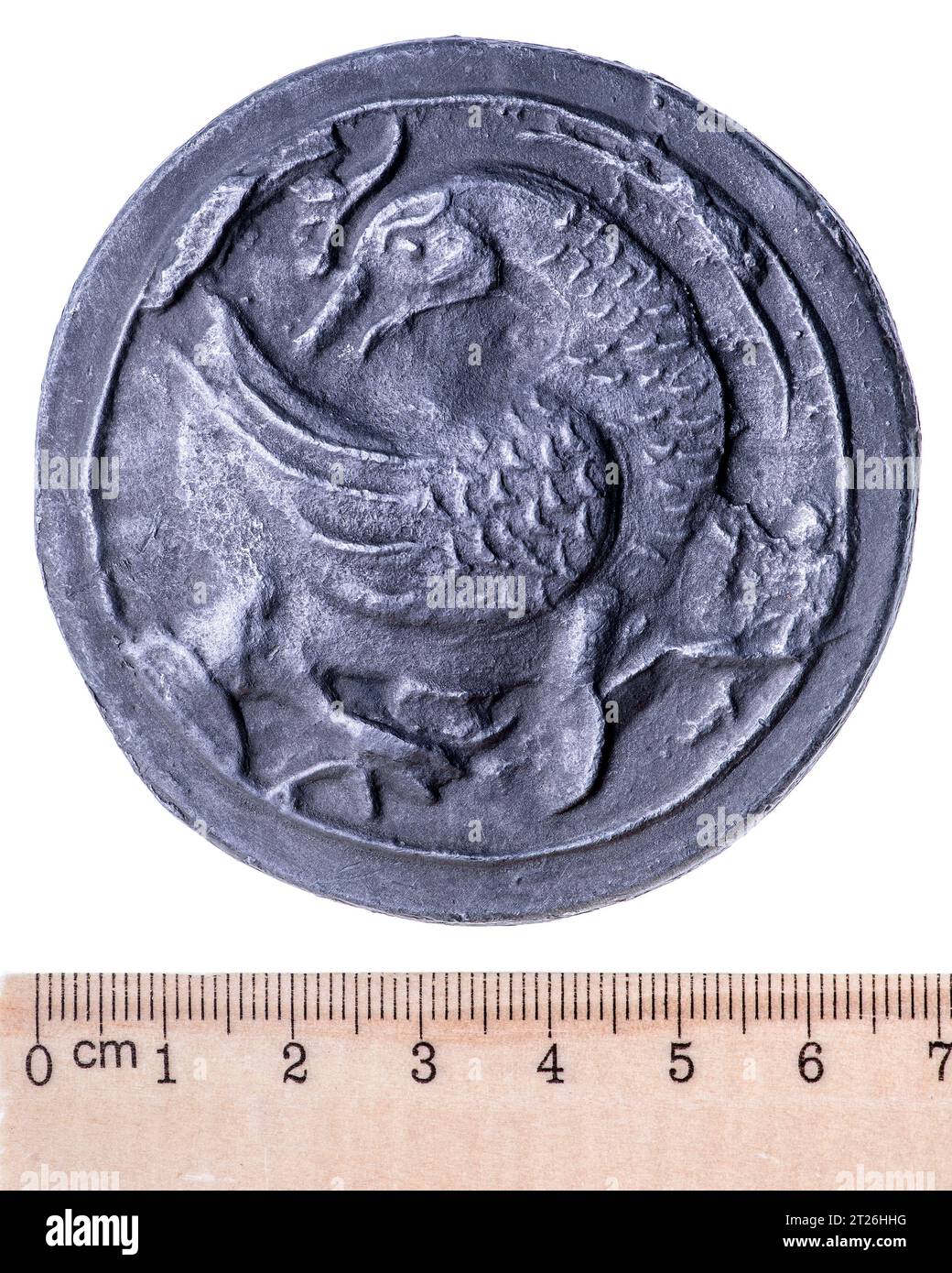 An ancient tin-zinc Burmese coin depicting a duck and fish. Obverse ...