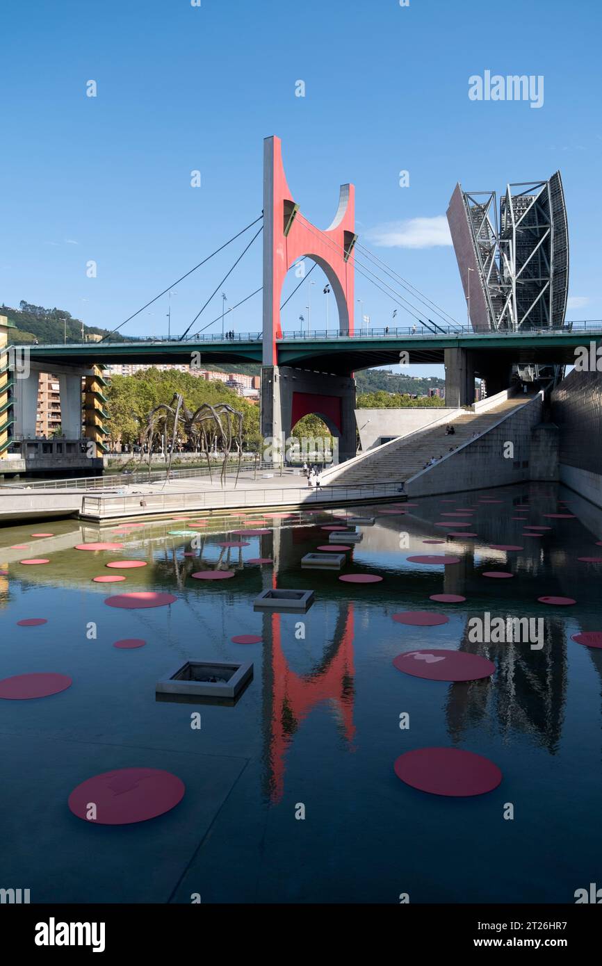 "L'arc rouge" (the red arc) on the La Salve bridge reflected in a pond ...
