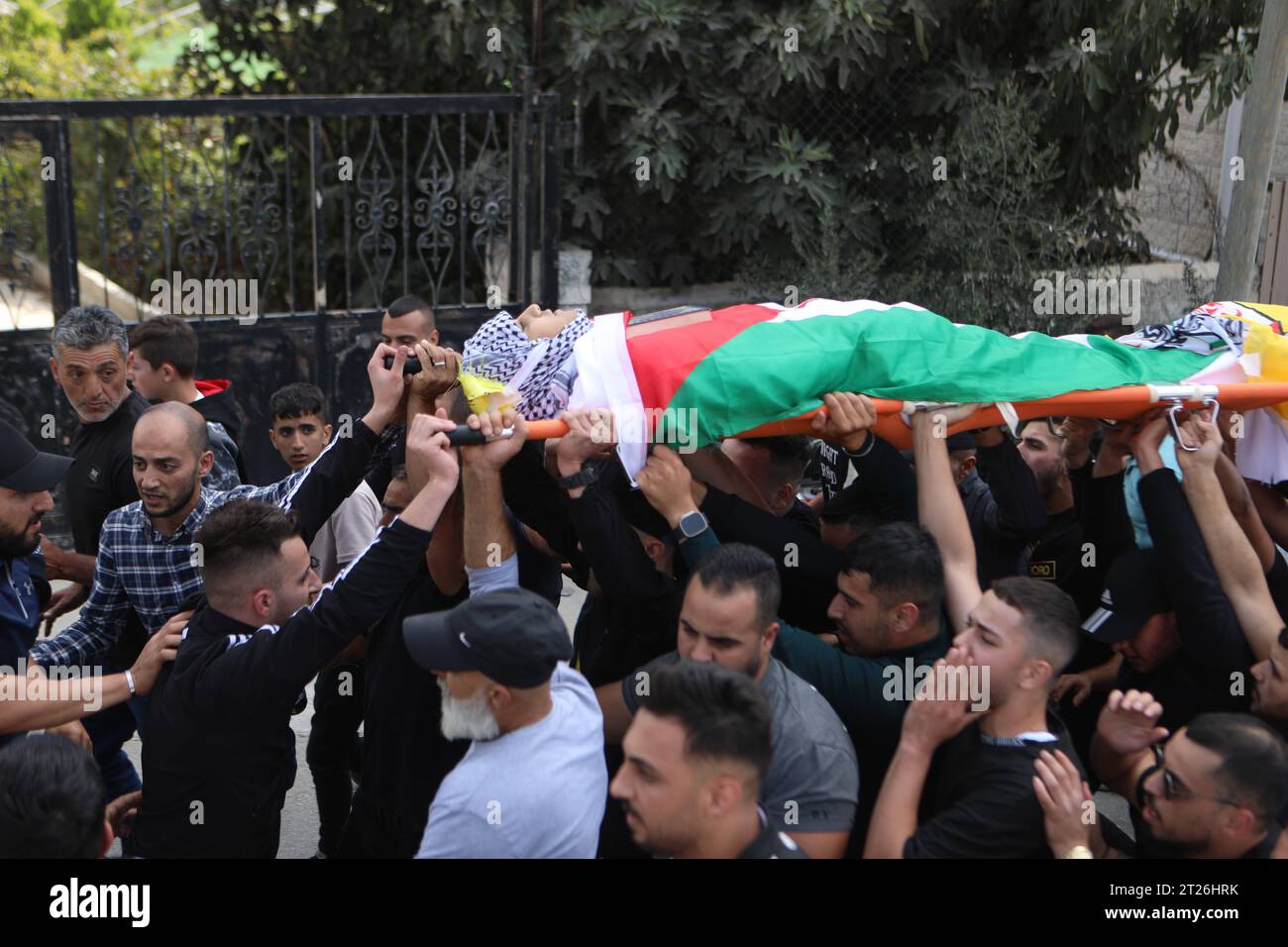 People carry the death body of 17-year-old Palestinian Muhammed Nidal ...