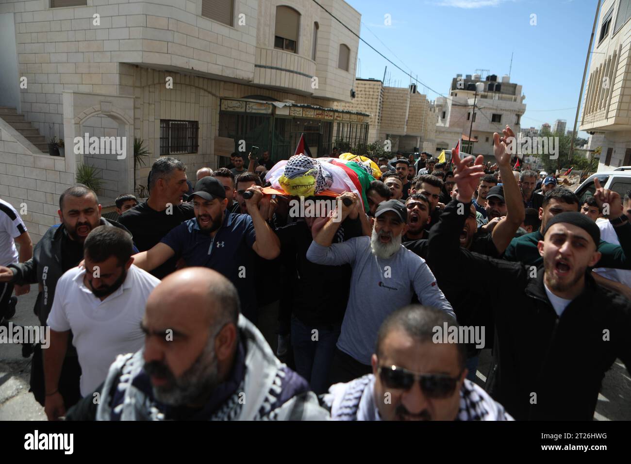 People carry the death body of 17-year-old Palestinian Muhammed Nidal ...