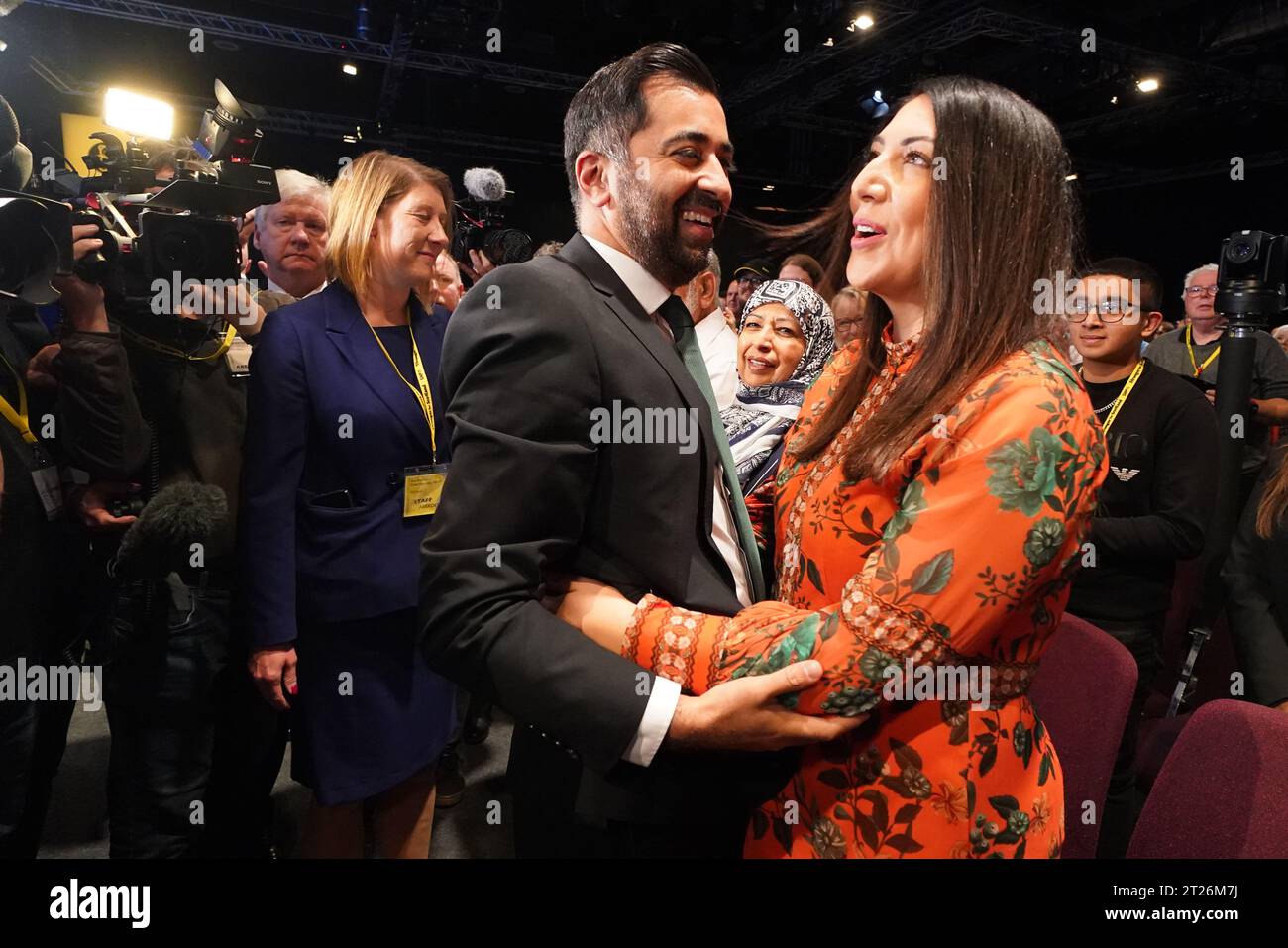 Scottish First Minister and SNP leader Humza Yousaf hugs his wife Nadia ...
