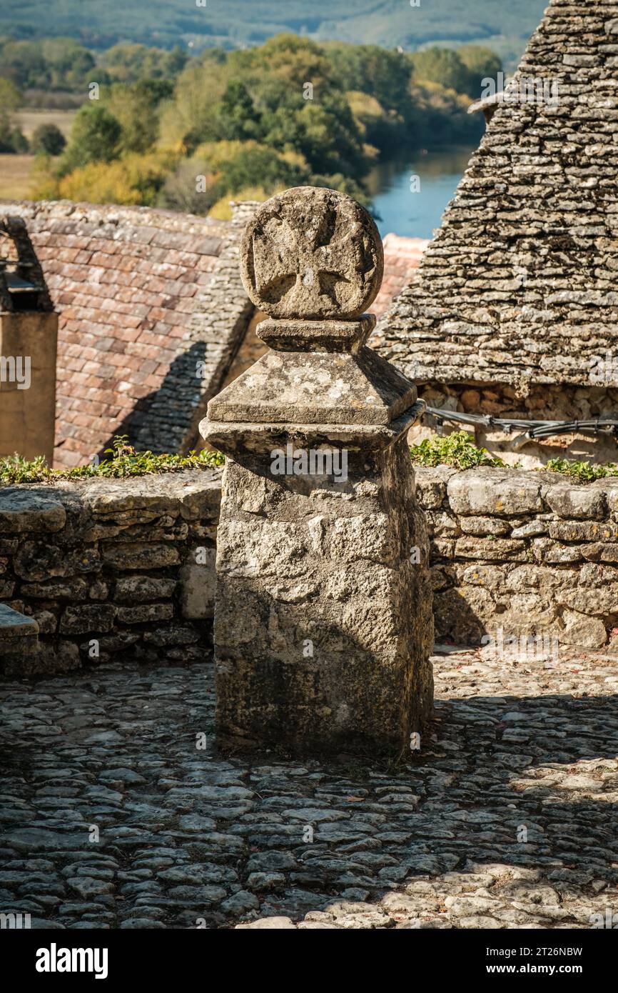 The Occitan cross in the Cafourche'square in Beynac-et-Cazenac in the ...