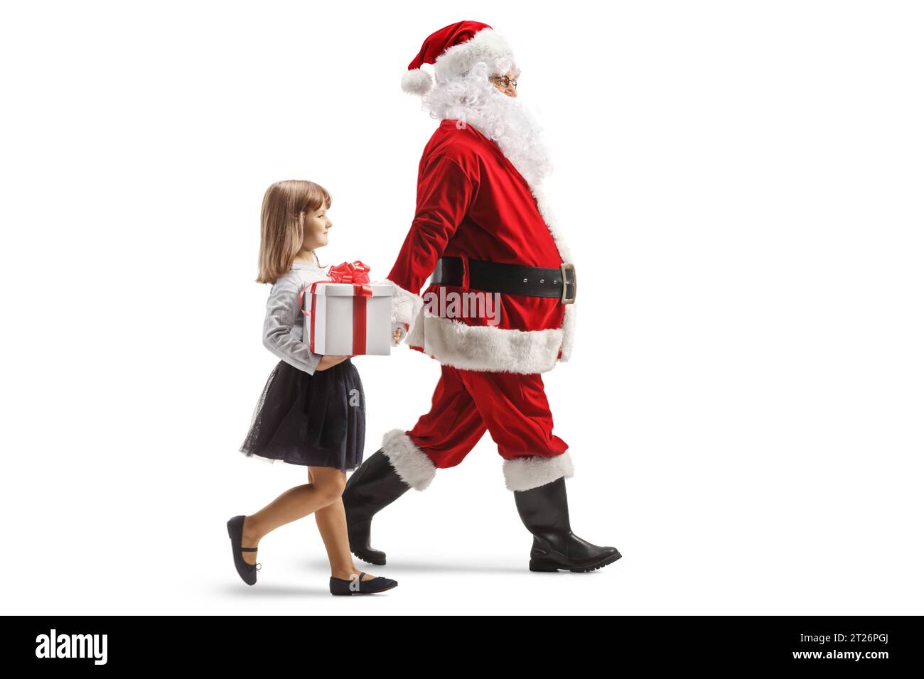 Santa claus holding a girl with a present by the hand and walking ...