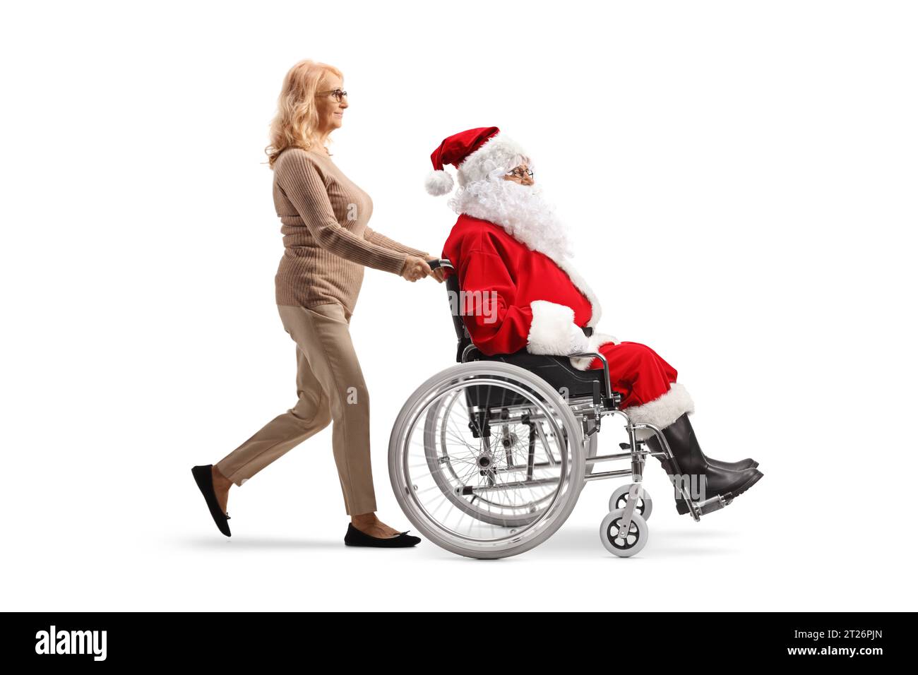 Full length profile shot of a woman pushing santa claus in a wheelchair ...