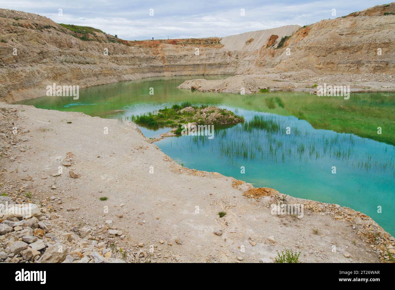 Lake formation in an old abandoned quarry. Quarry lake. Crushed stone ...