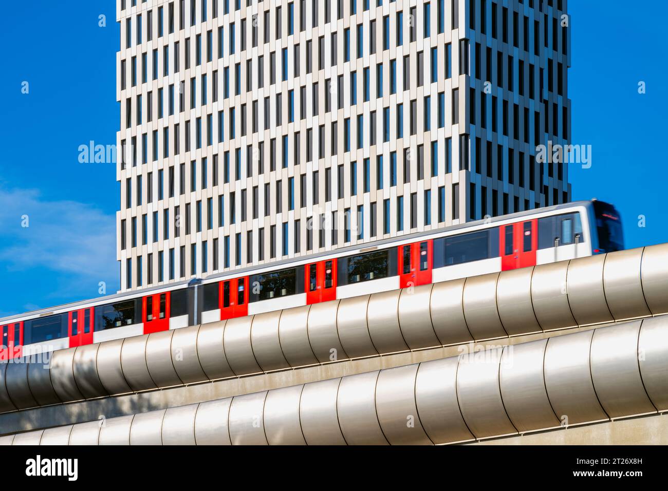 Elevated Subway Train passing a Modern Office building in Amsterdam ...