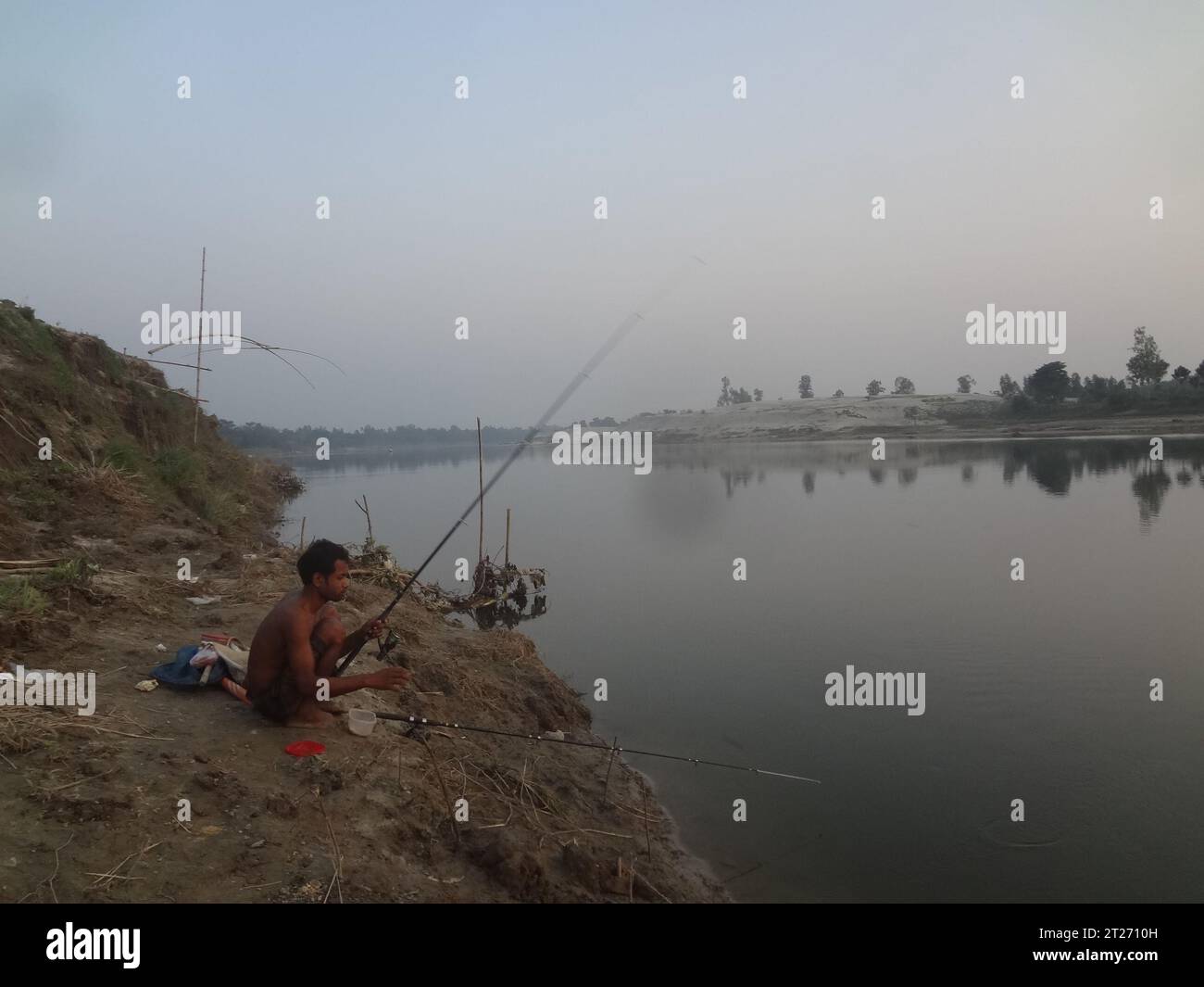 Naogaon, Bangladesh. 17th Oct, 2023. A man fishing in Atrai river ...