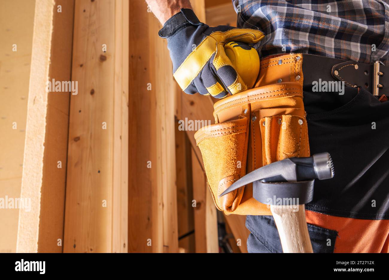 Professional Contractor Worker and His Tools Belt Close Up. Hand on the ...