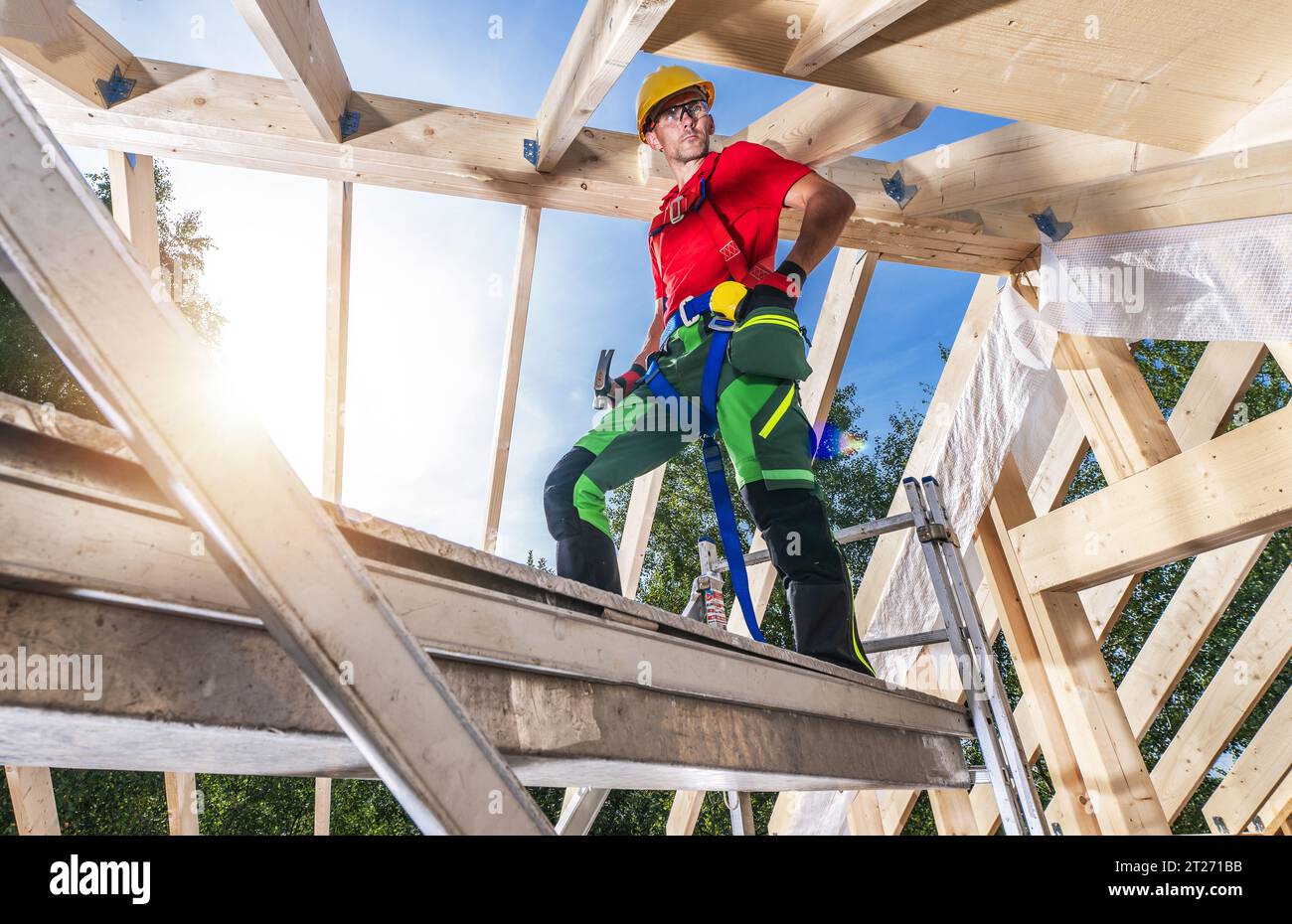 Caucasian Construction Site Worker in His 40s Building Wooden House ...