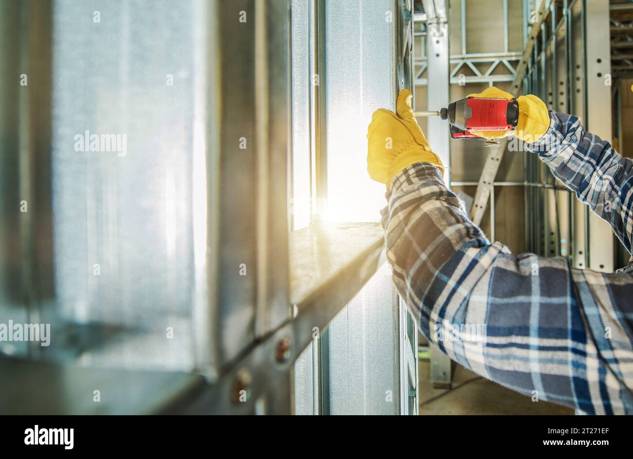Construction Contractor Worker with Drill Driver Building Metal House ...